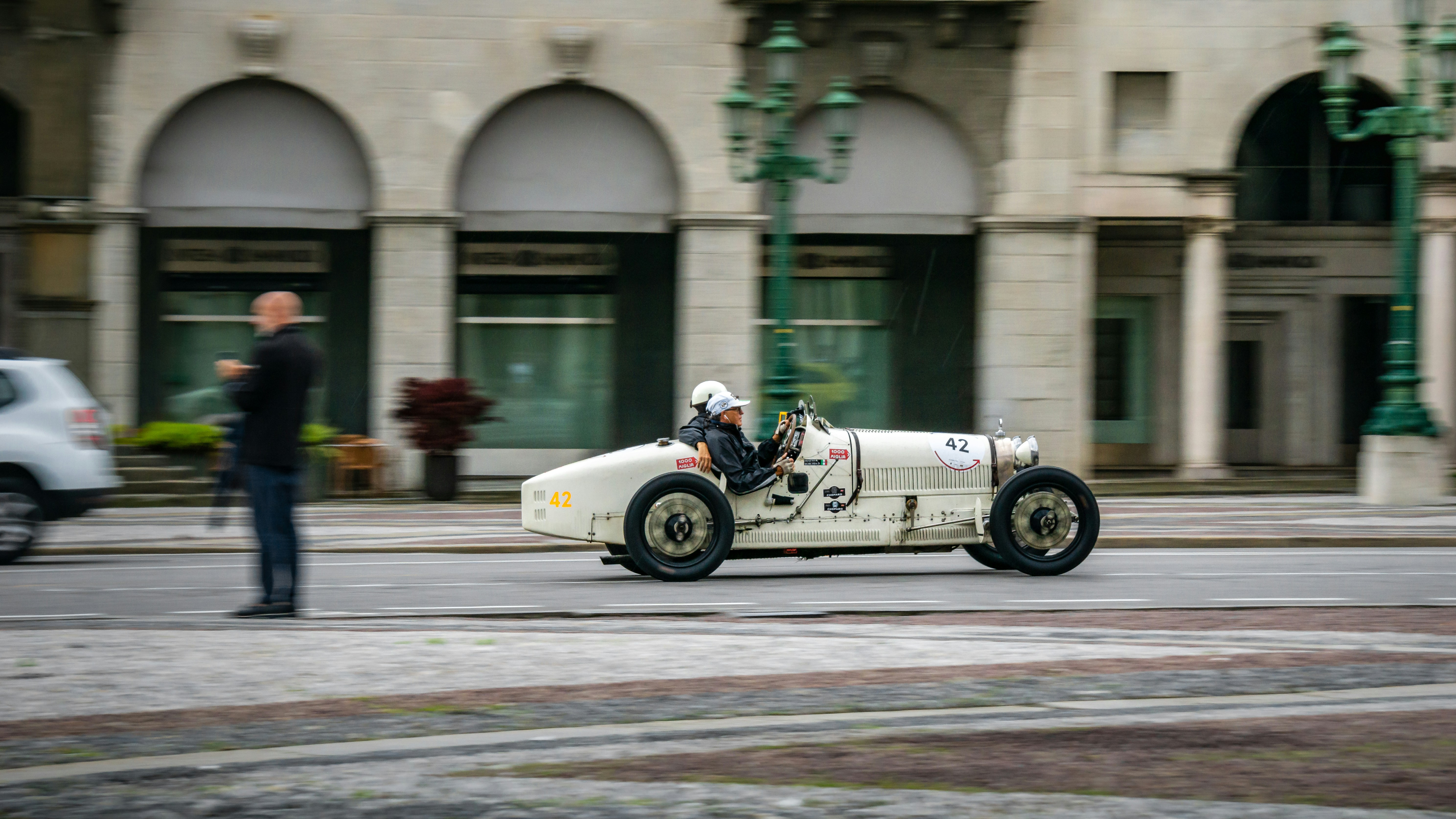 Vintage Racecar Rumbles Through a City Street