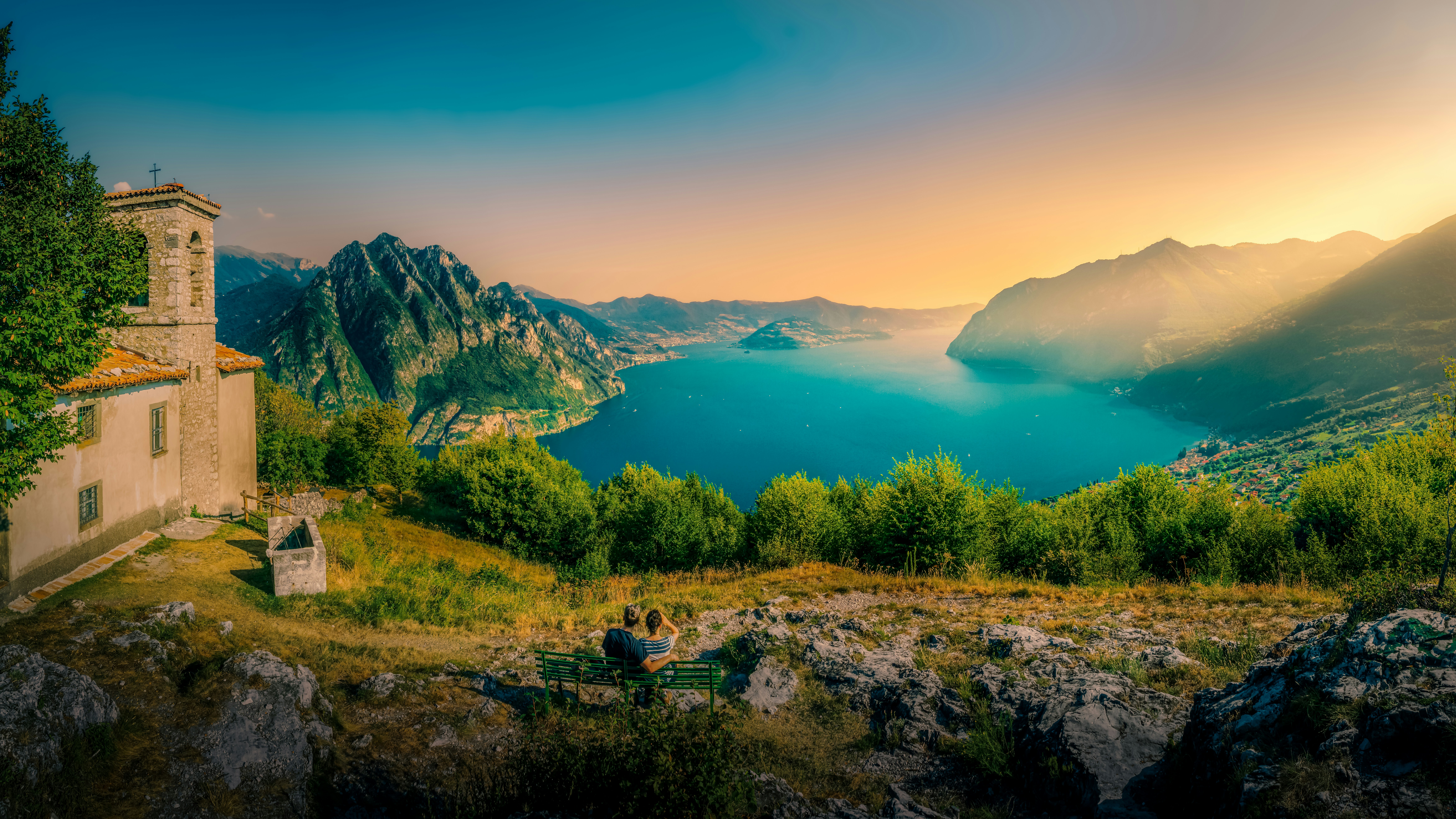 Golden Hour Overlooking a Mediterranean Lake from a Cliffside Terrace
