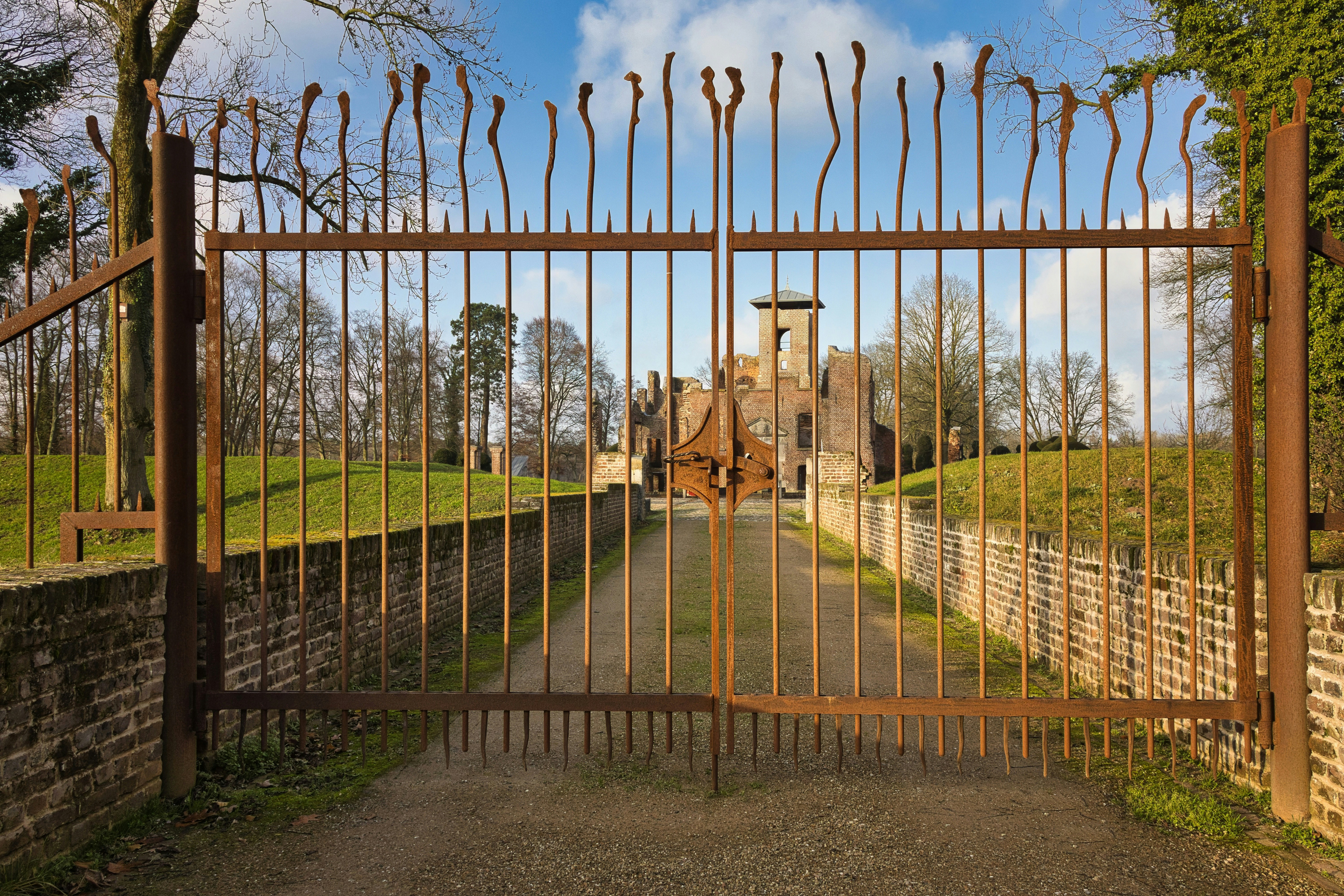 Gate to the Memorial Grounds: Rod-iron Spires Framing a Path