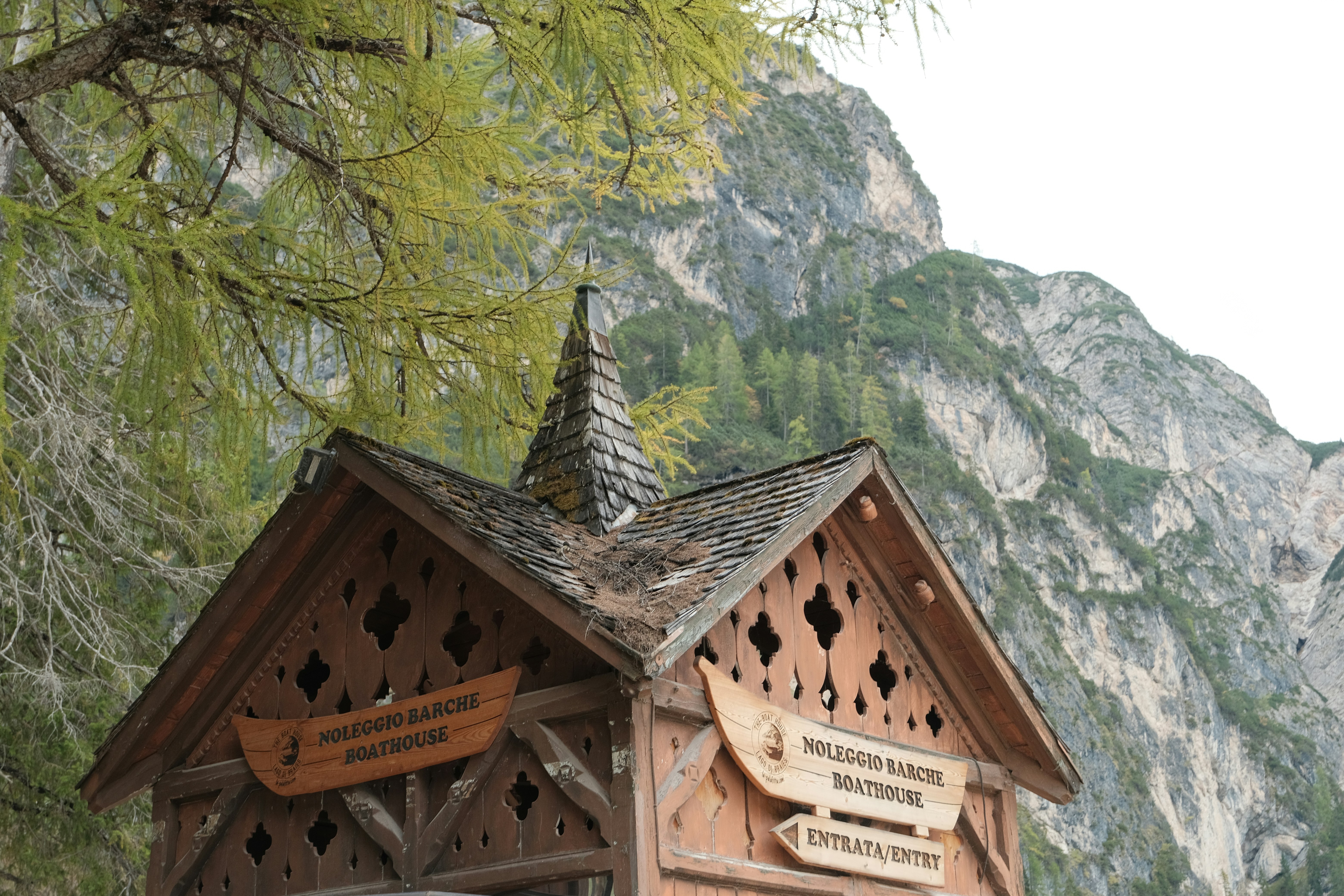 Wooden Chalet Gate Anchored by Alpine Backdrop