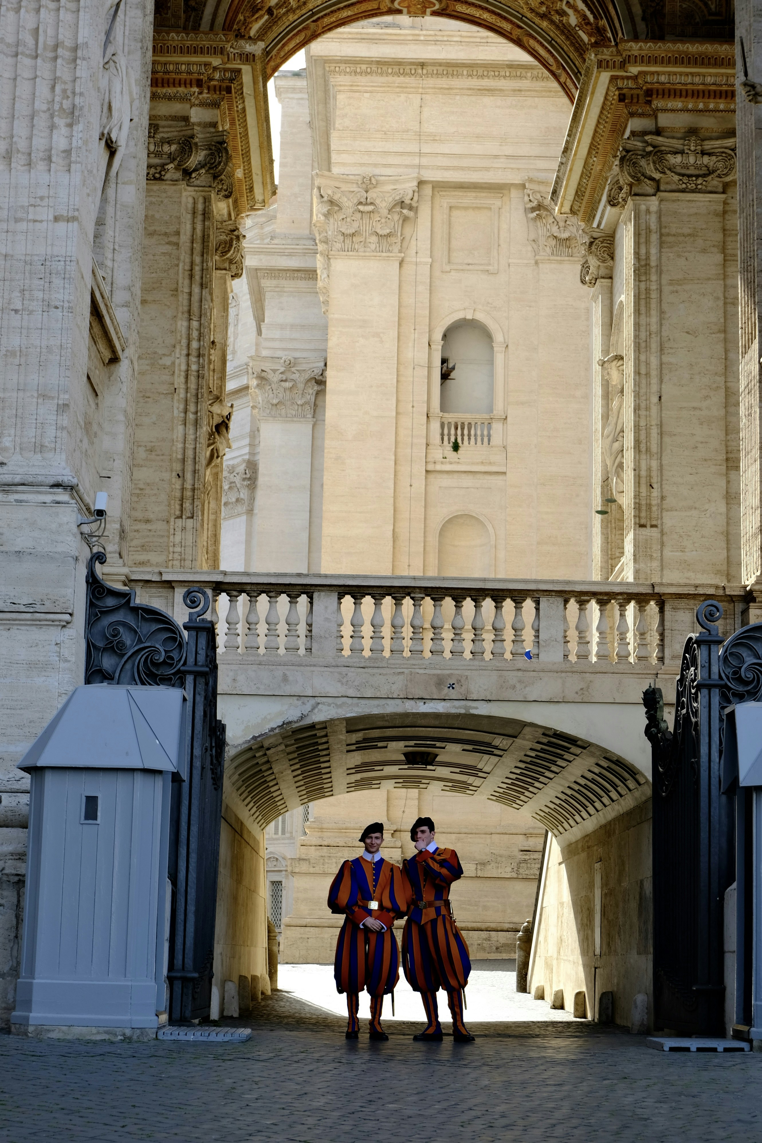 Guardians of the Arch: Dueling Attendants beneath a Historic Portal