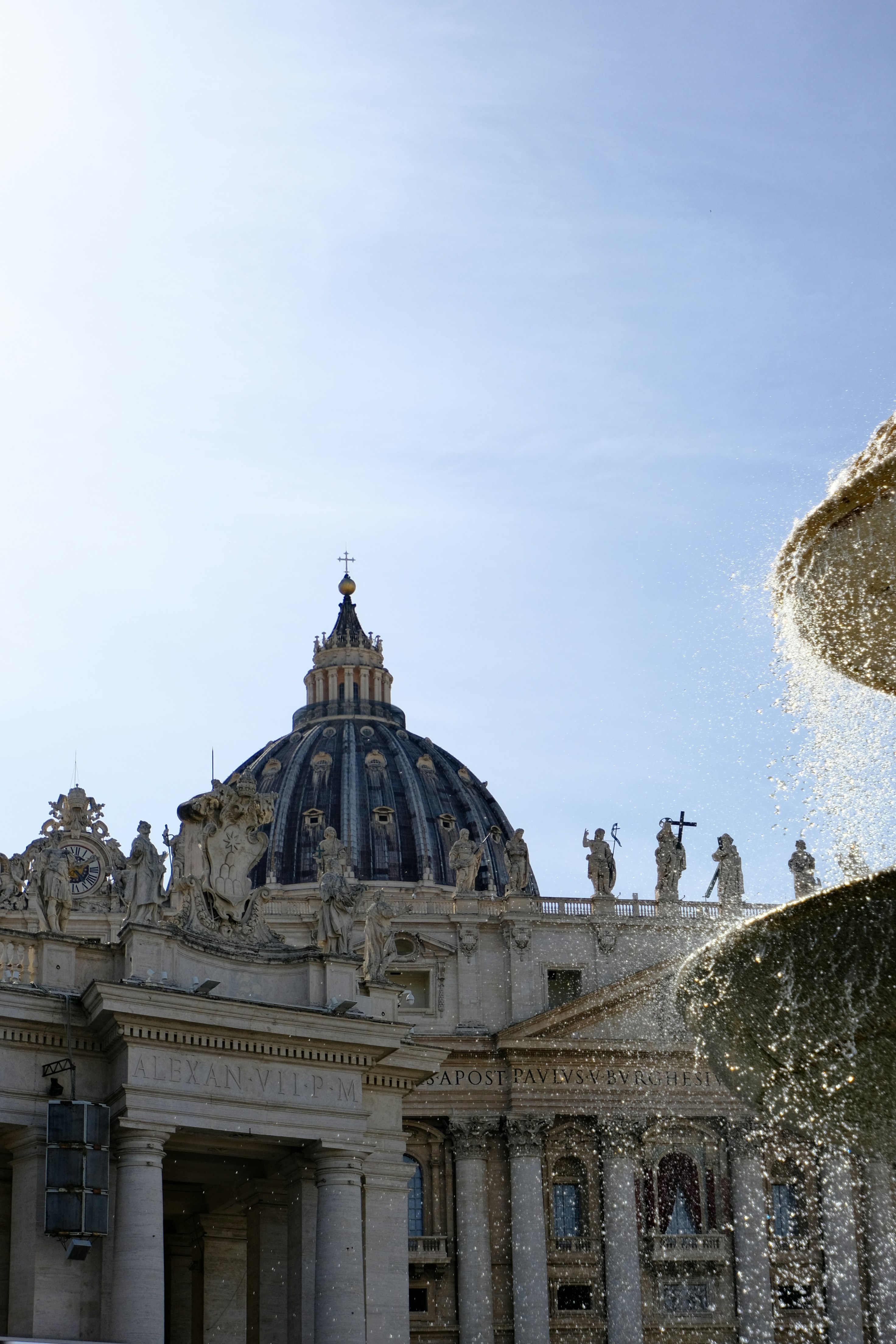 Dome and Fountains: A Baroque Facade Under a Clear Sky
