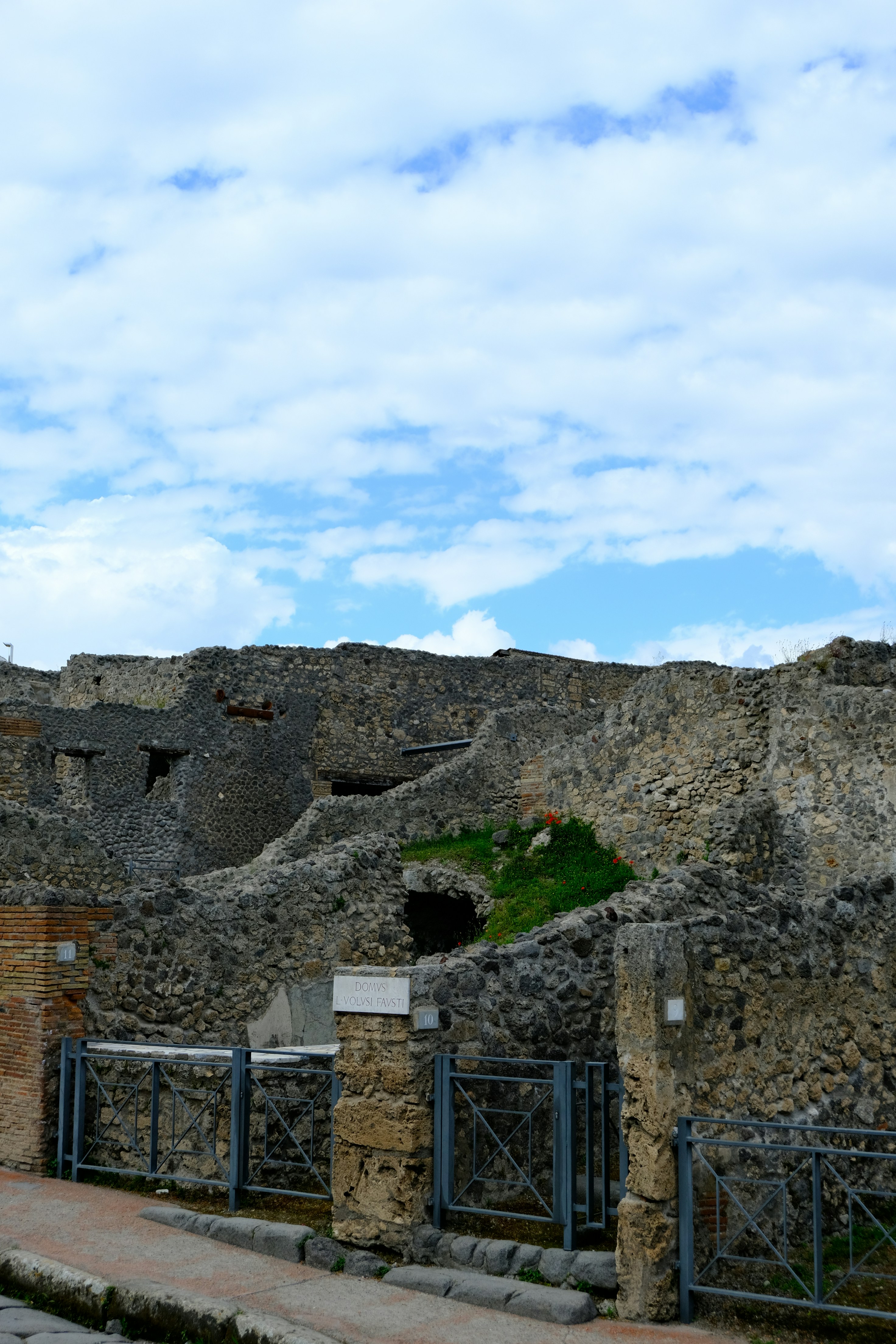 Stone Fortress Under a Bright Corridor of Sky