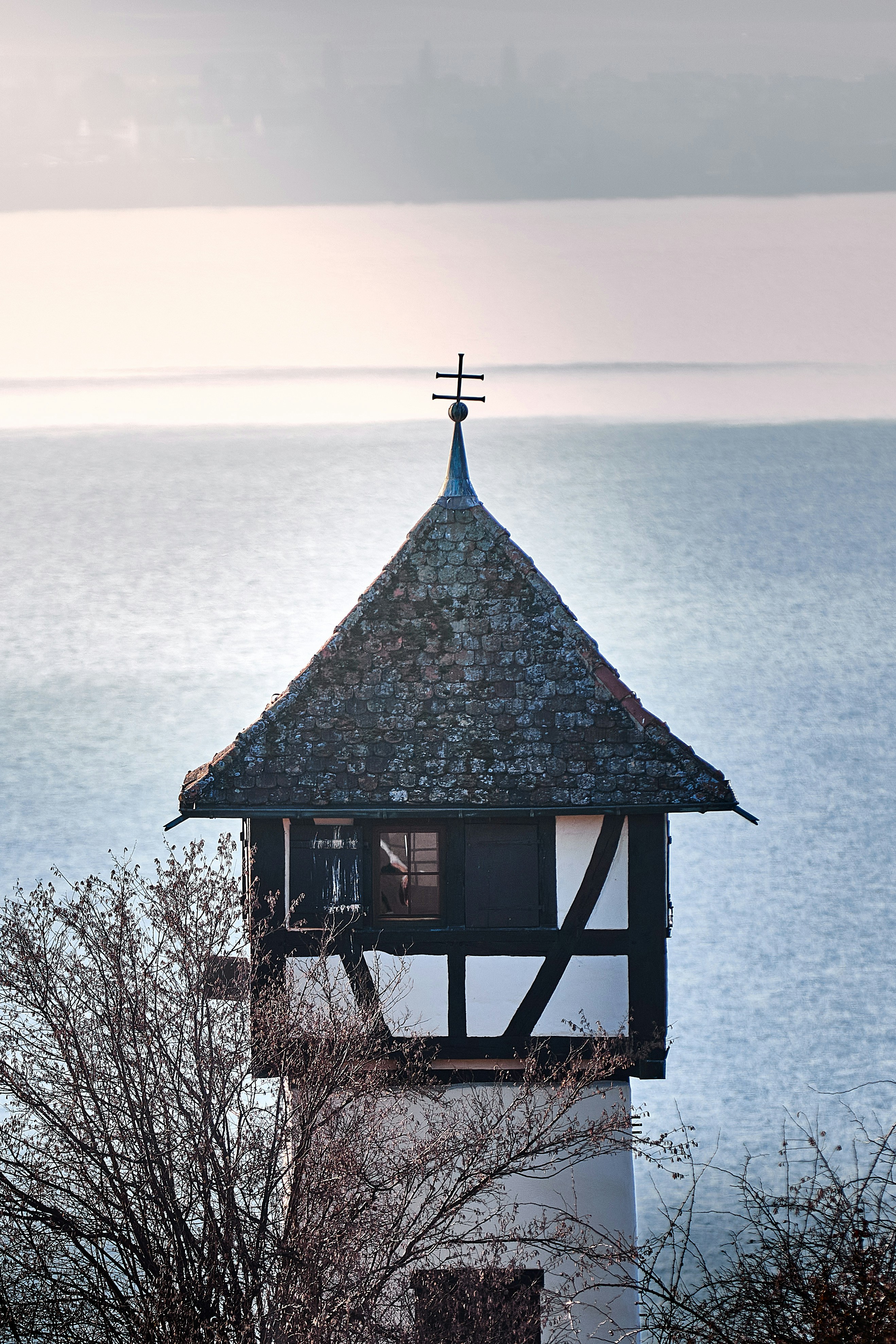 Lighthouse Crown: A Weathered Roof Reaches Toward the Sea
