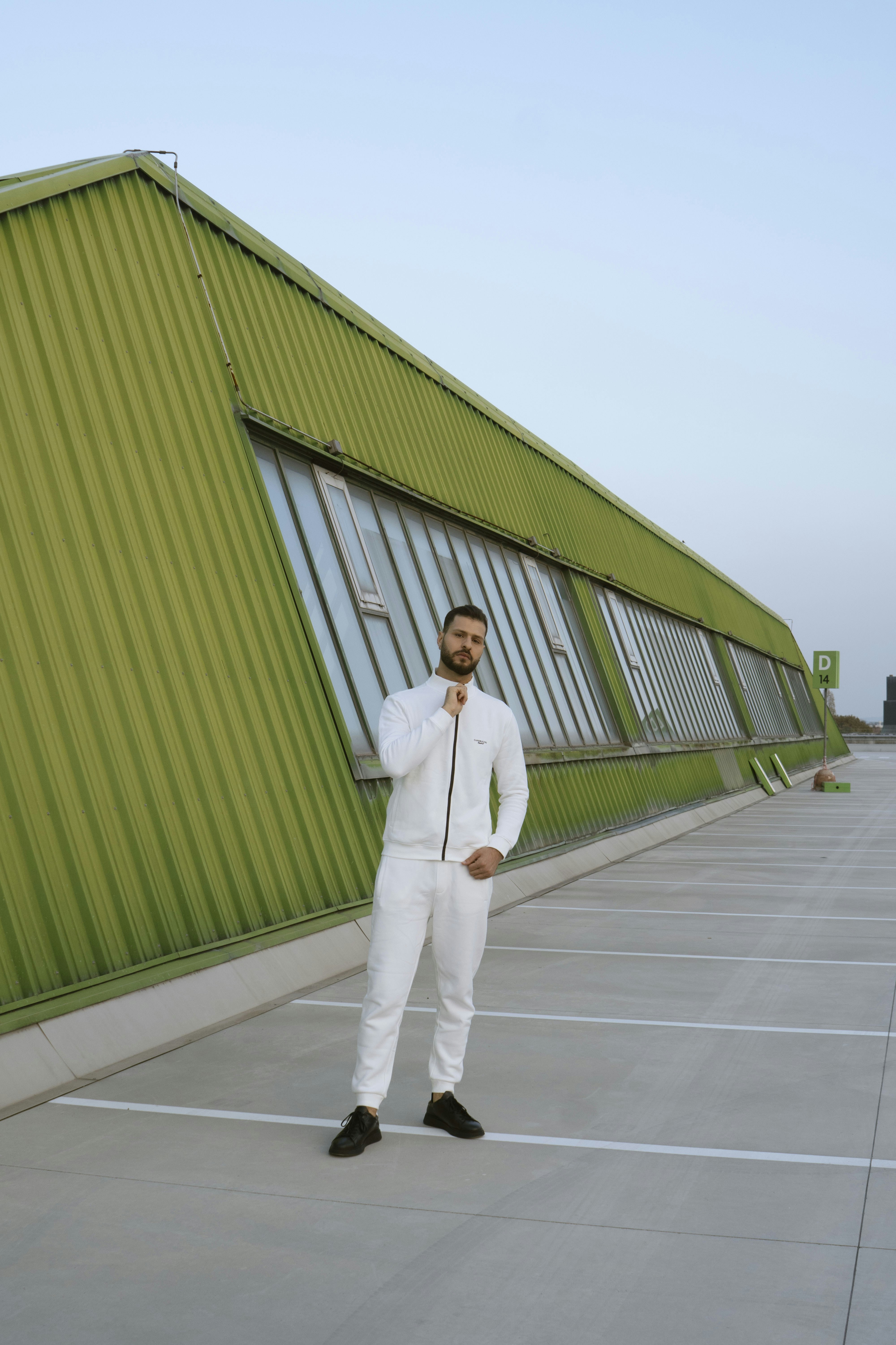 White-suited portrait در industrial greencline