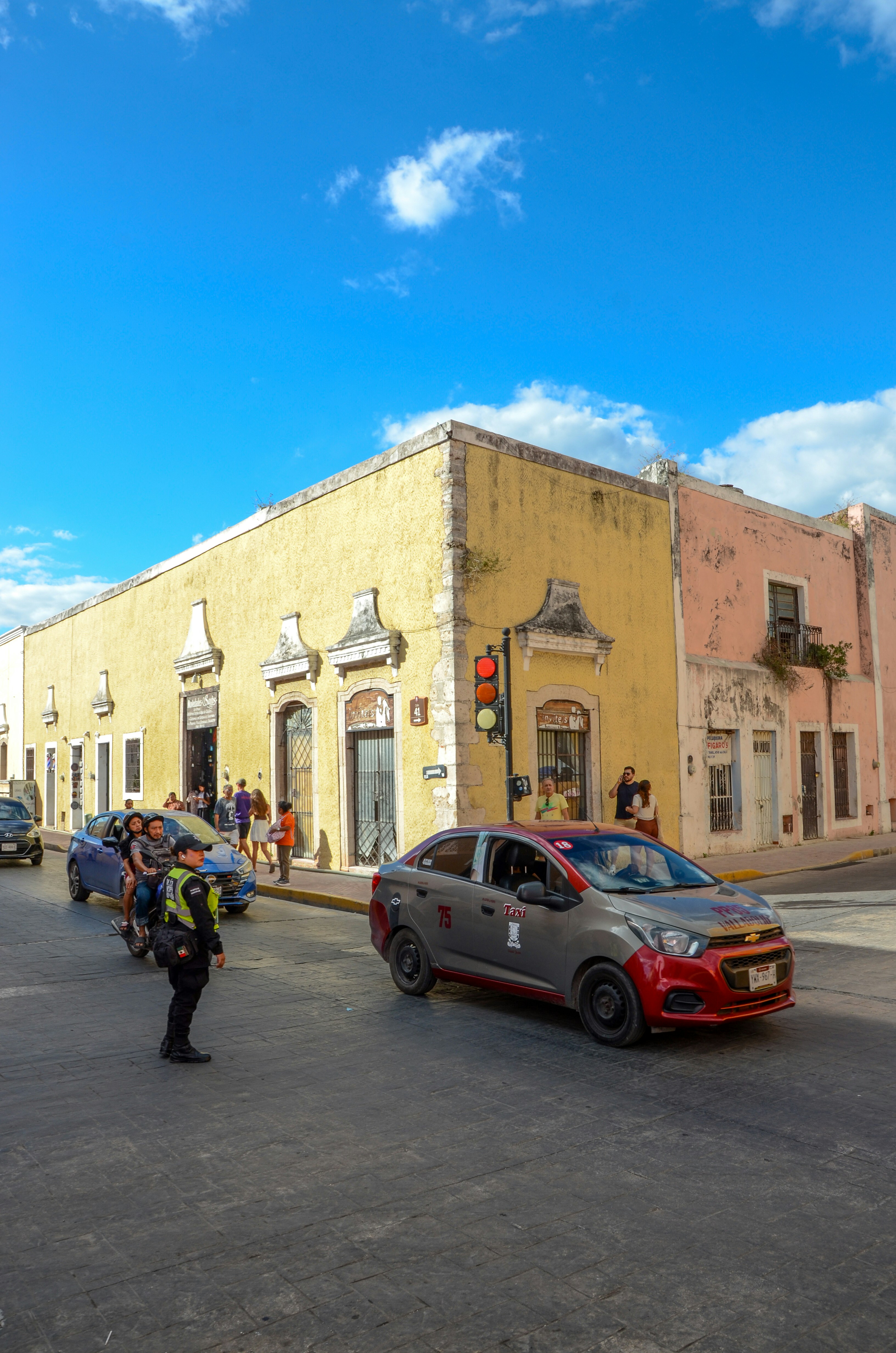 Crossroads in Old Town: Colorful Facades and a Taxiscape