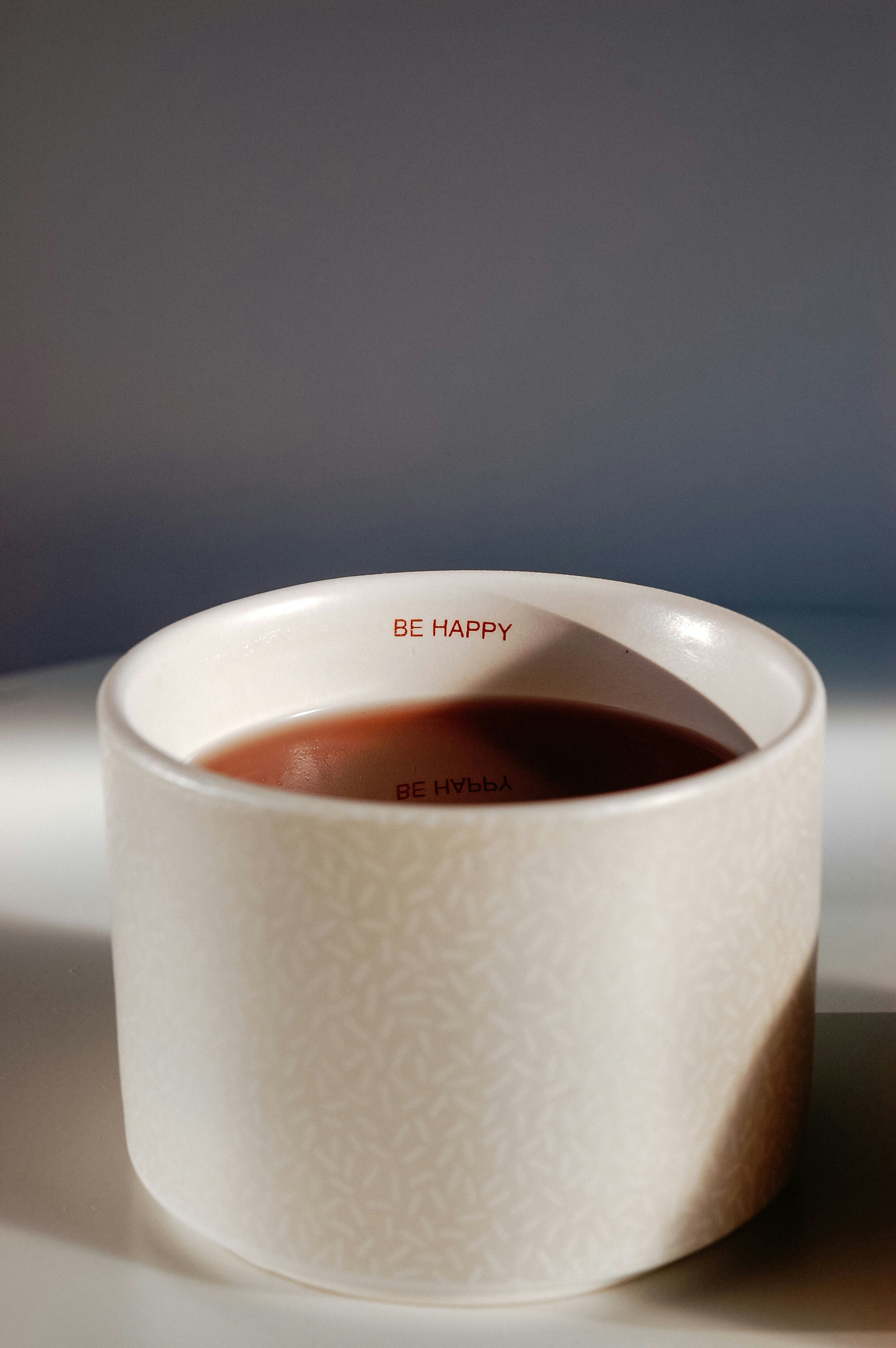 Be Happy: A Tiny Cup of Calm on a Soft Gradient Stage