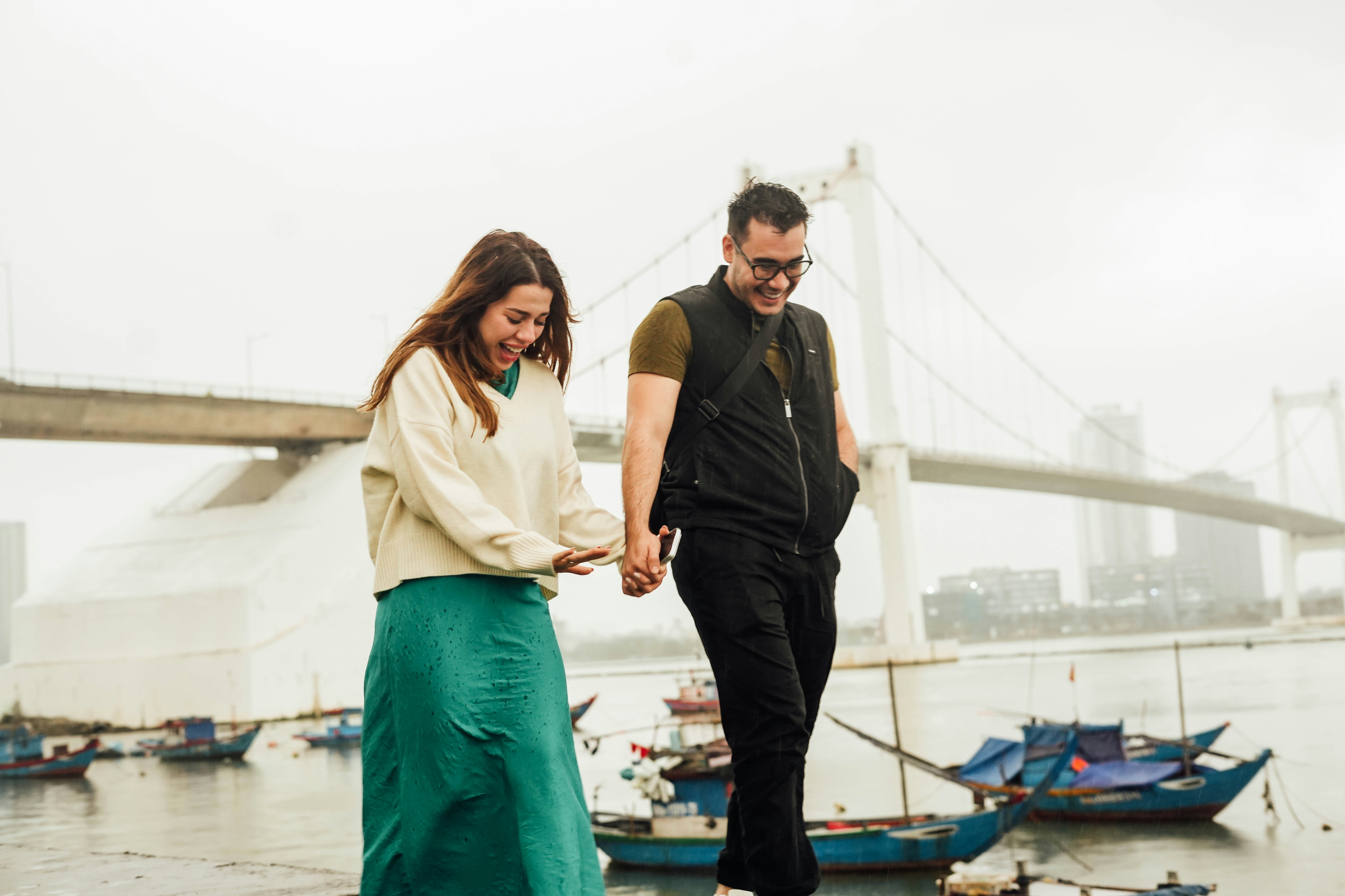 Holding Hands by the Waterfront Bridge