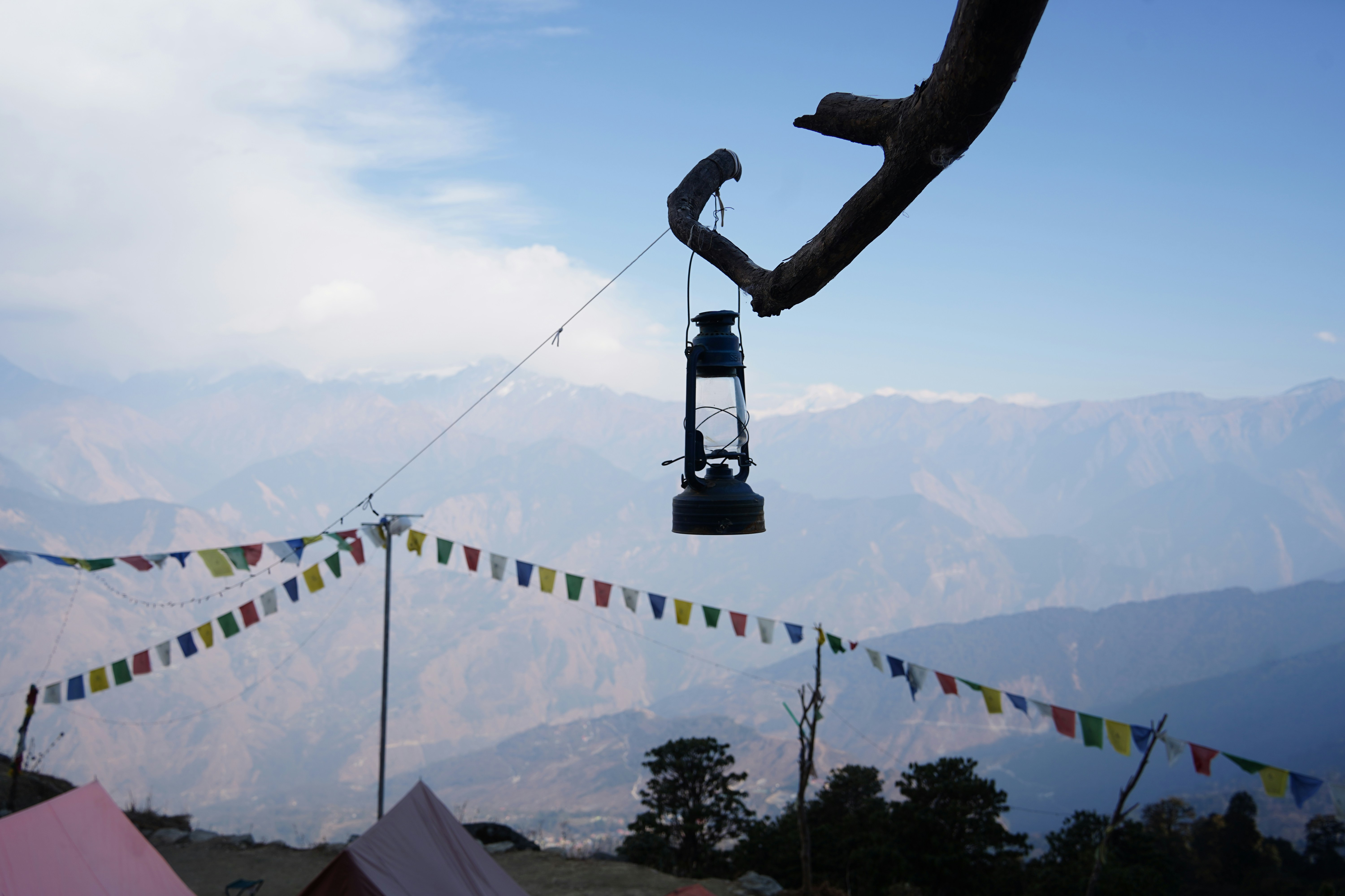 Lone Lantern Suspended Above a Himalayan Ridge