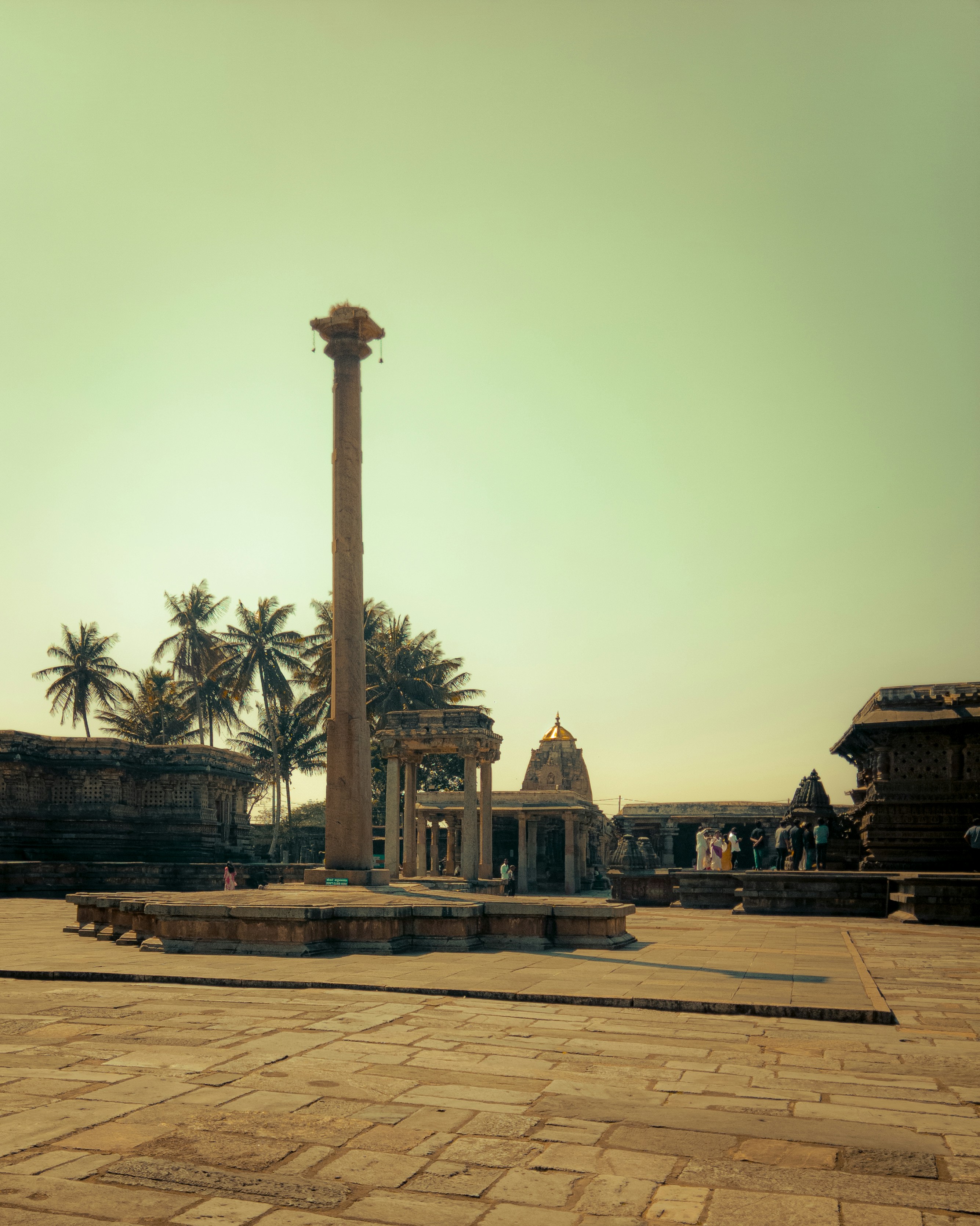 Ancient stone pillar in a temple courtyard