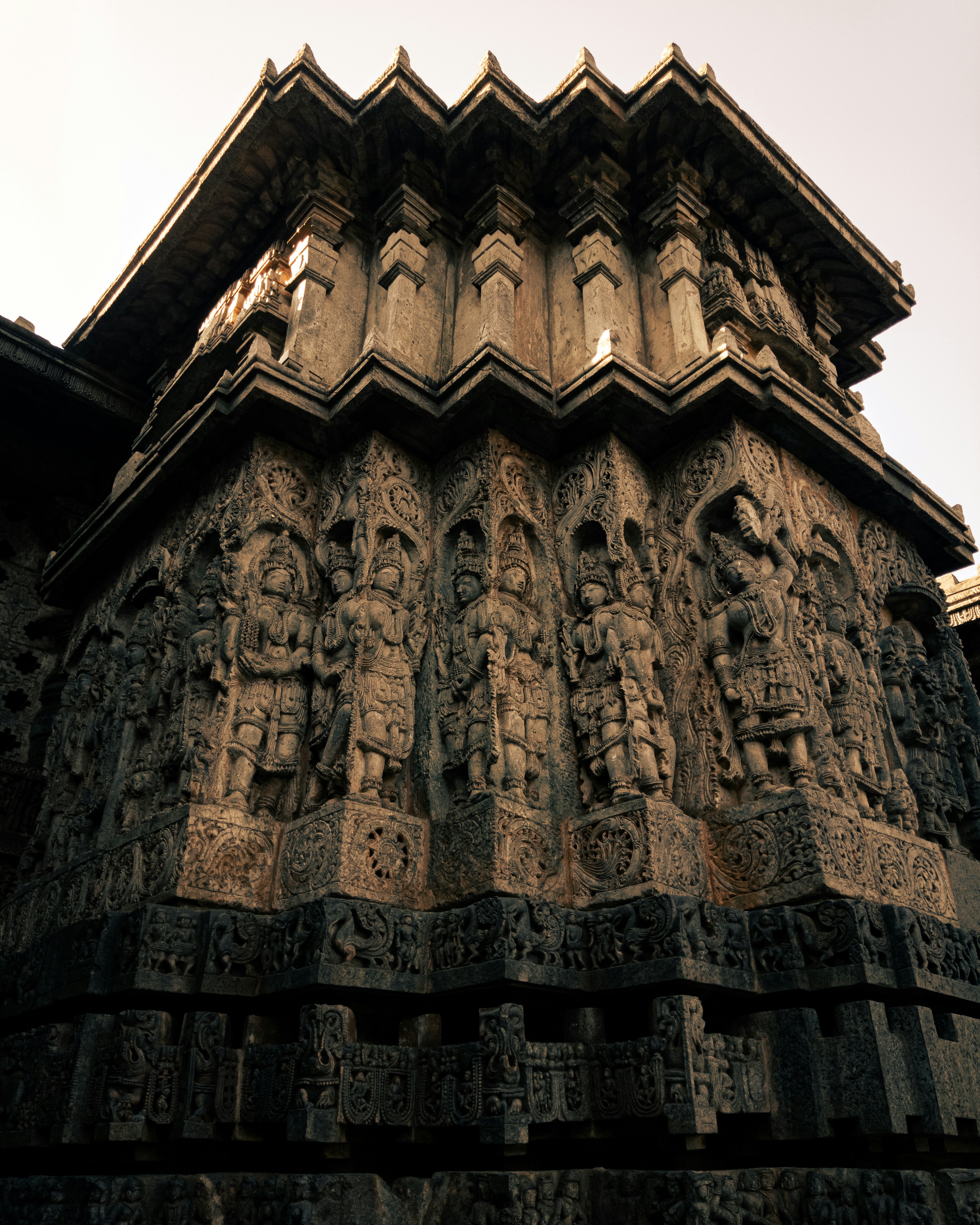 Intricate stone carvings adorn ancient temple wall