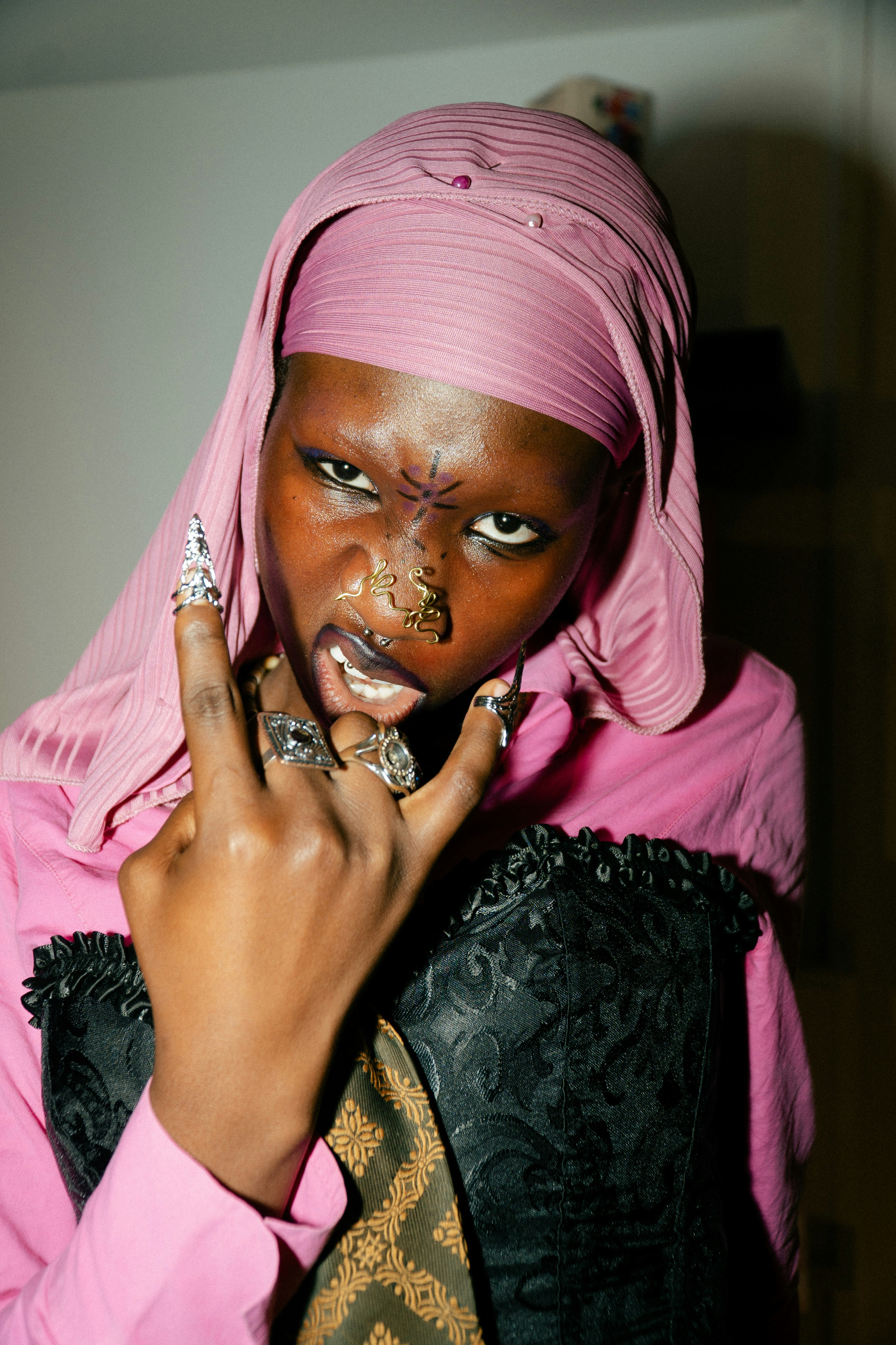 Pink Veiled Persona: A Bold Portrait Under Soft Studio Light