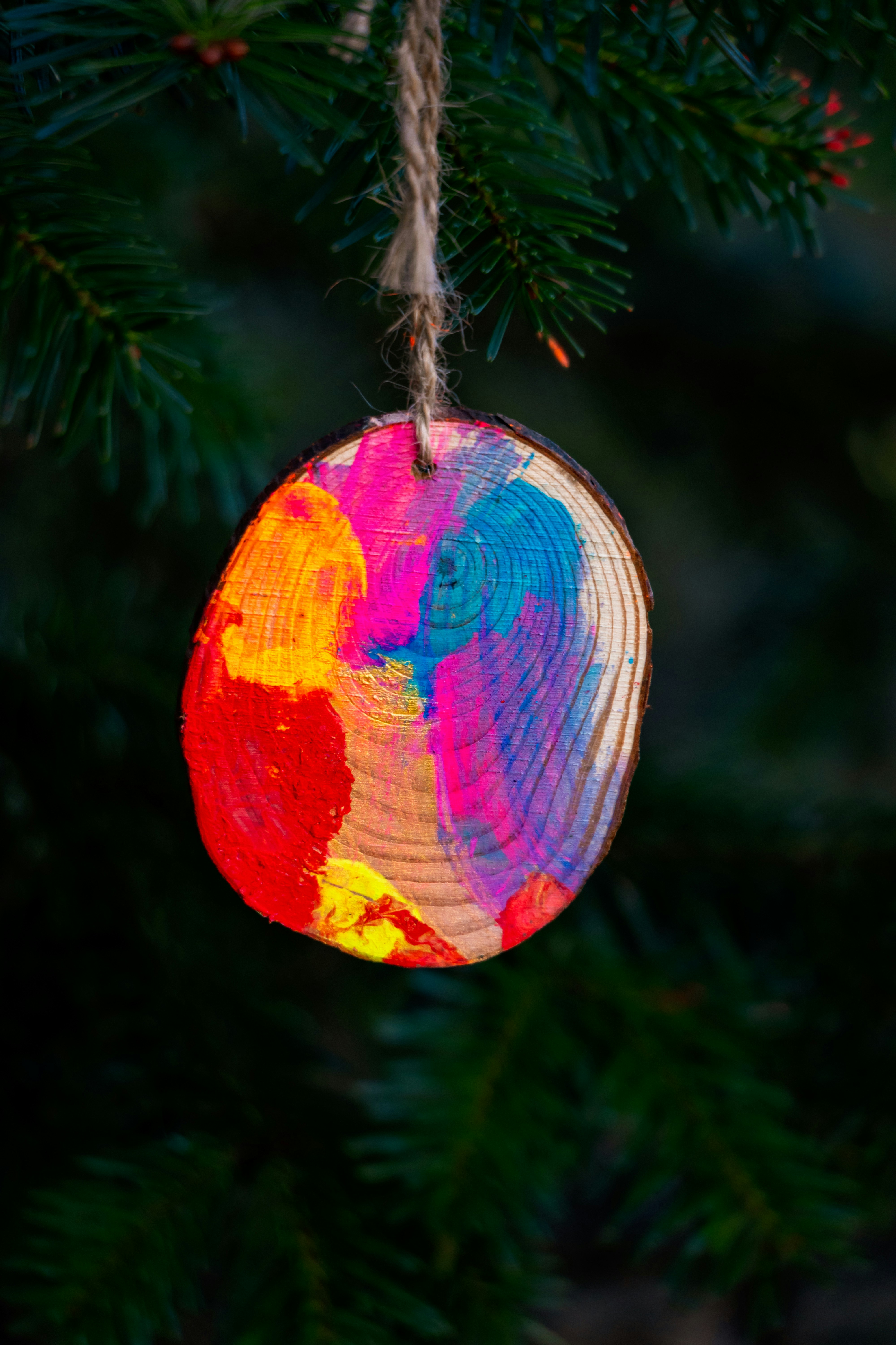 Painted Ornament on a Looming Evergreen