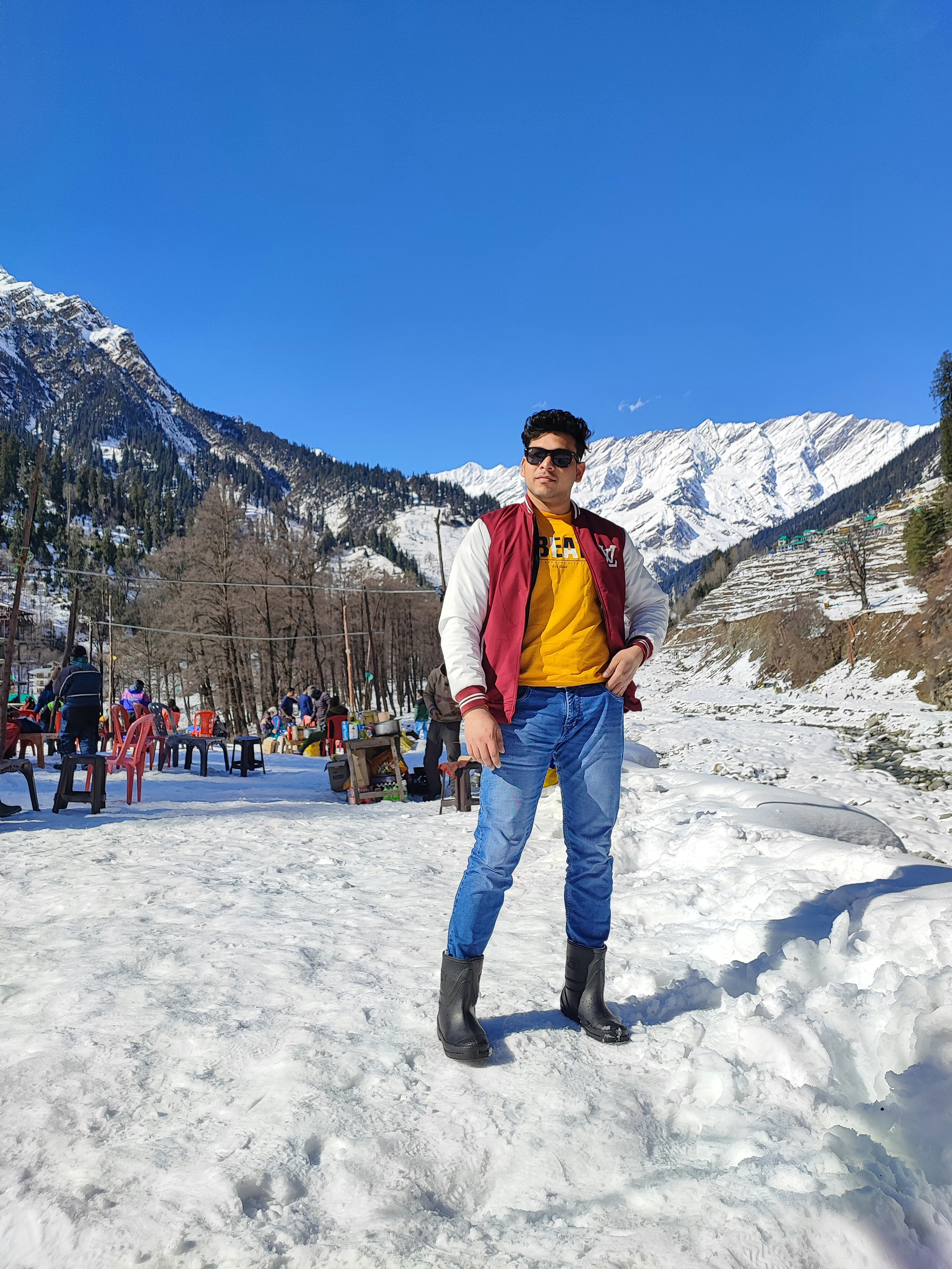 Man standing in a snowy mountain landscape