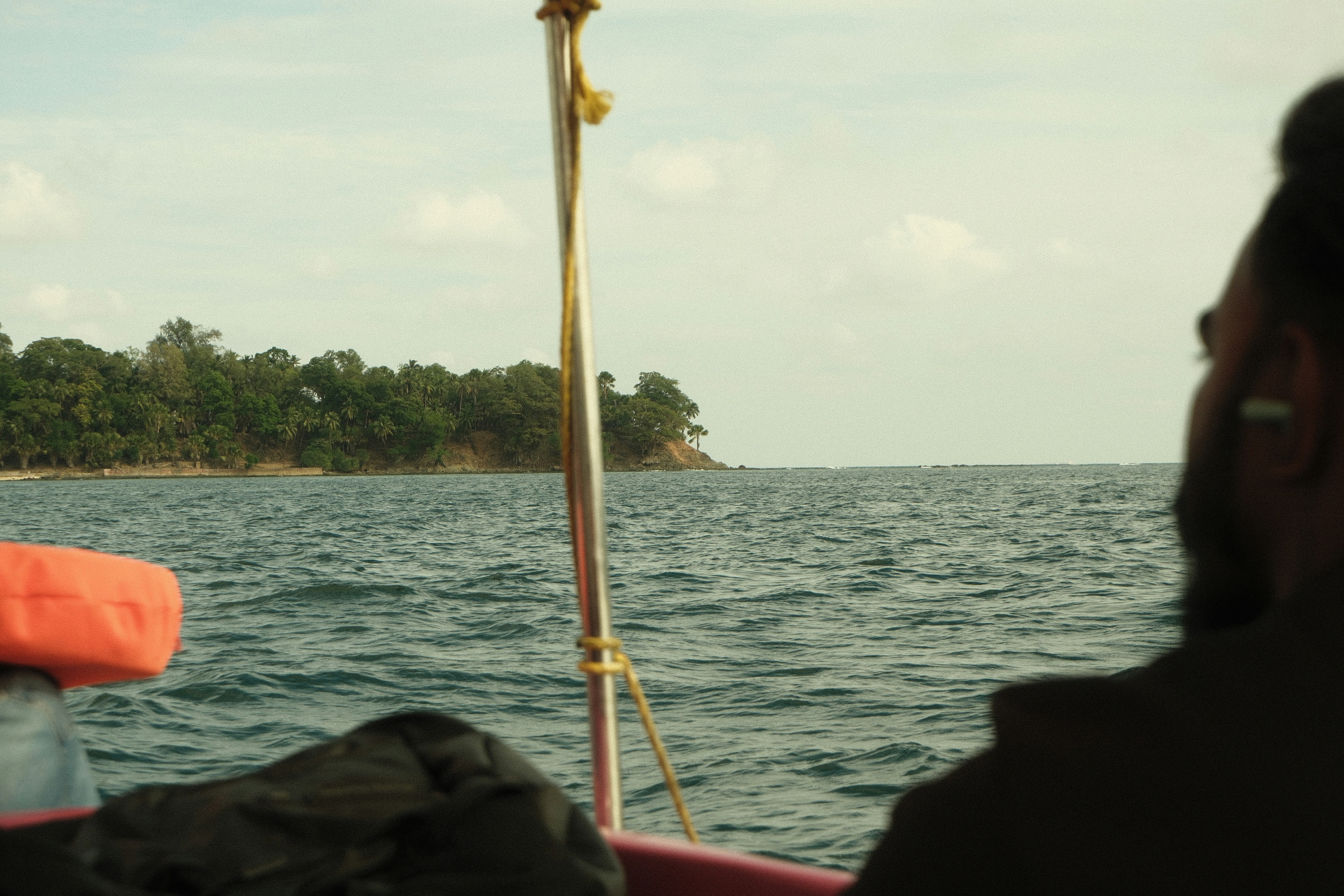 Quiet Horizon Aboard: Framing the Sea and a Distant Shore