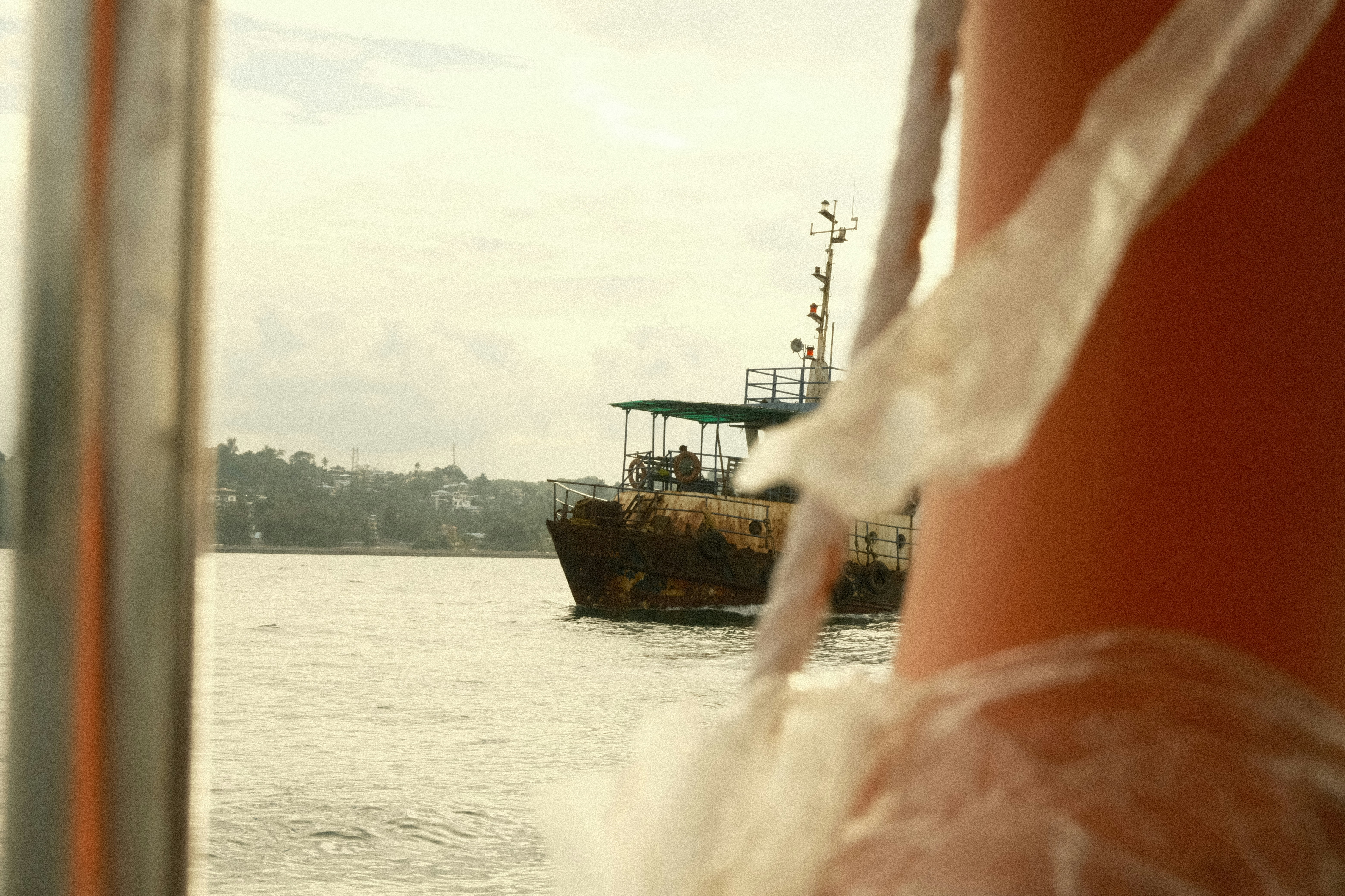 Distant Tug Amid Veiled Vessels