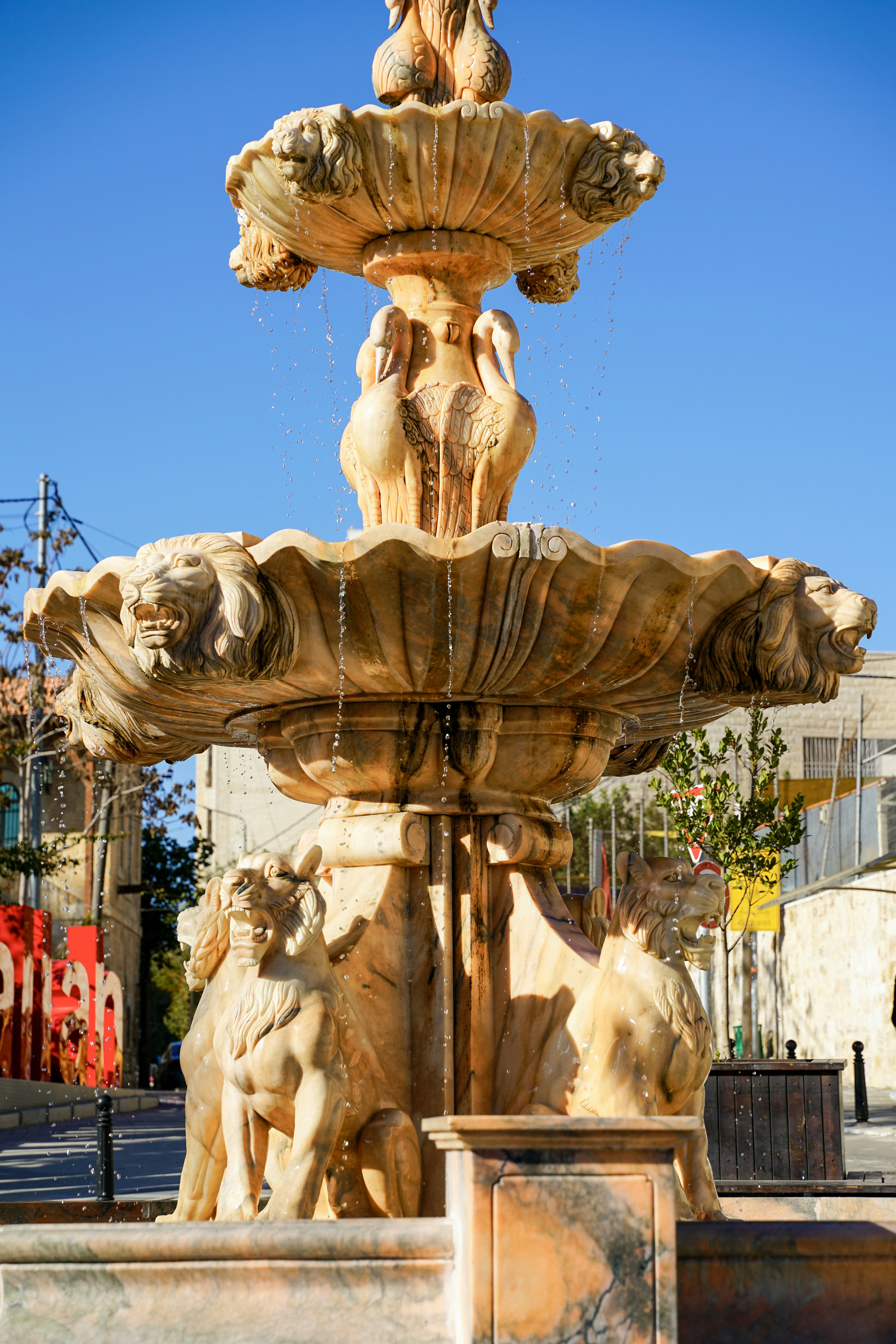 Sunlit Font of Lions: A Timeless Tiered Fountain in Warm Calabria Light