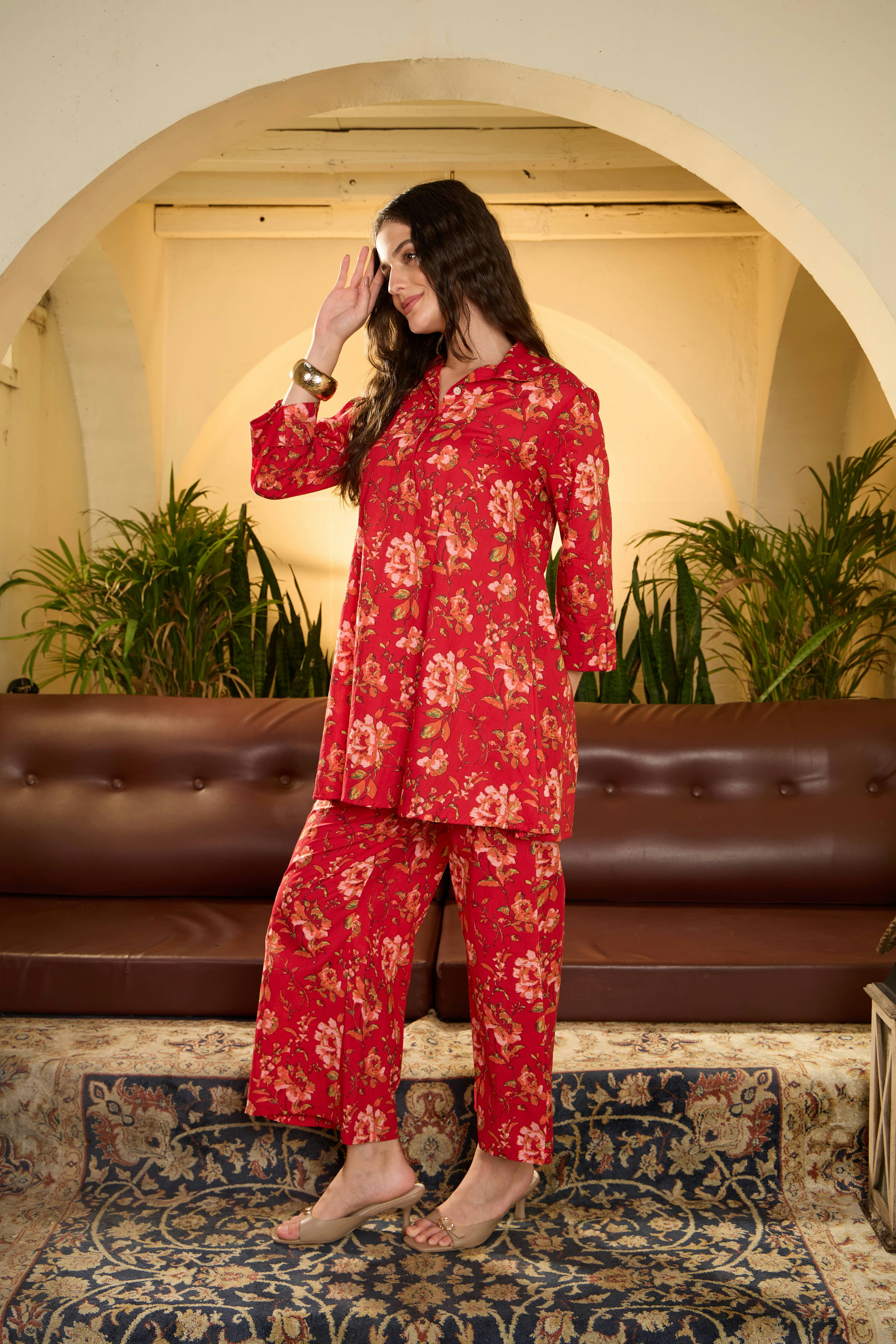 Red Floral Ensemble in an Arched Lounge