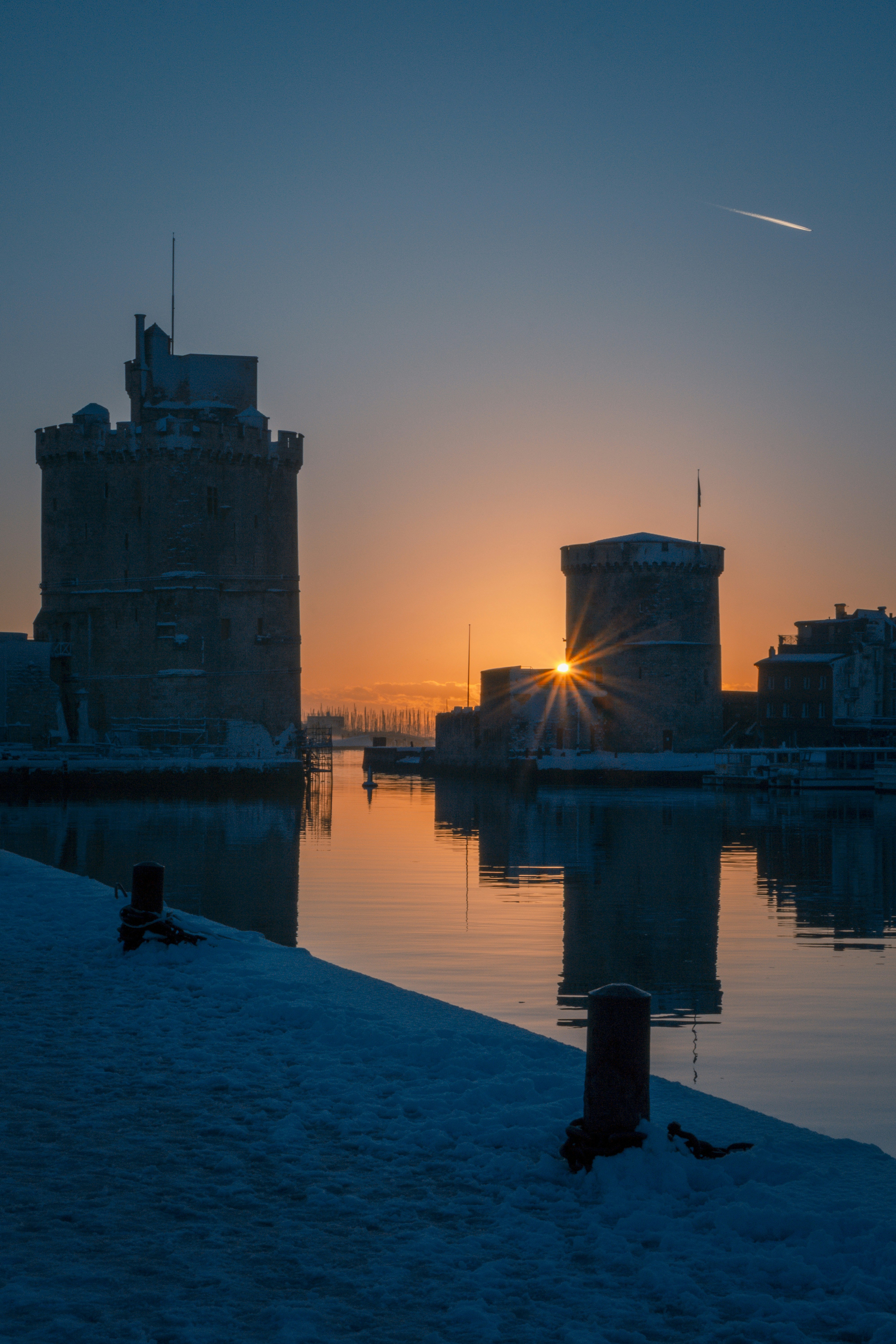 Sunrise at the Harbor Walls: Winter Light on the Waterfront