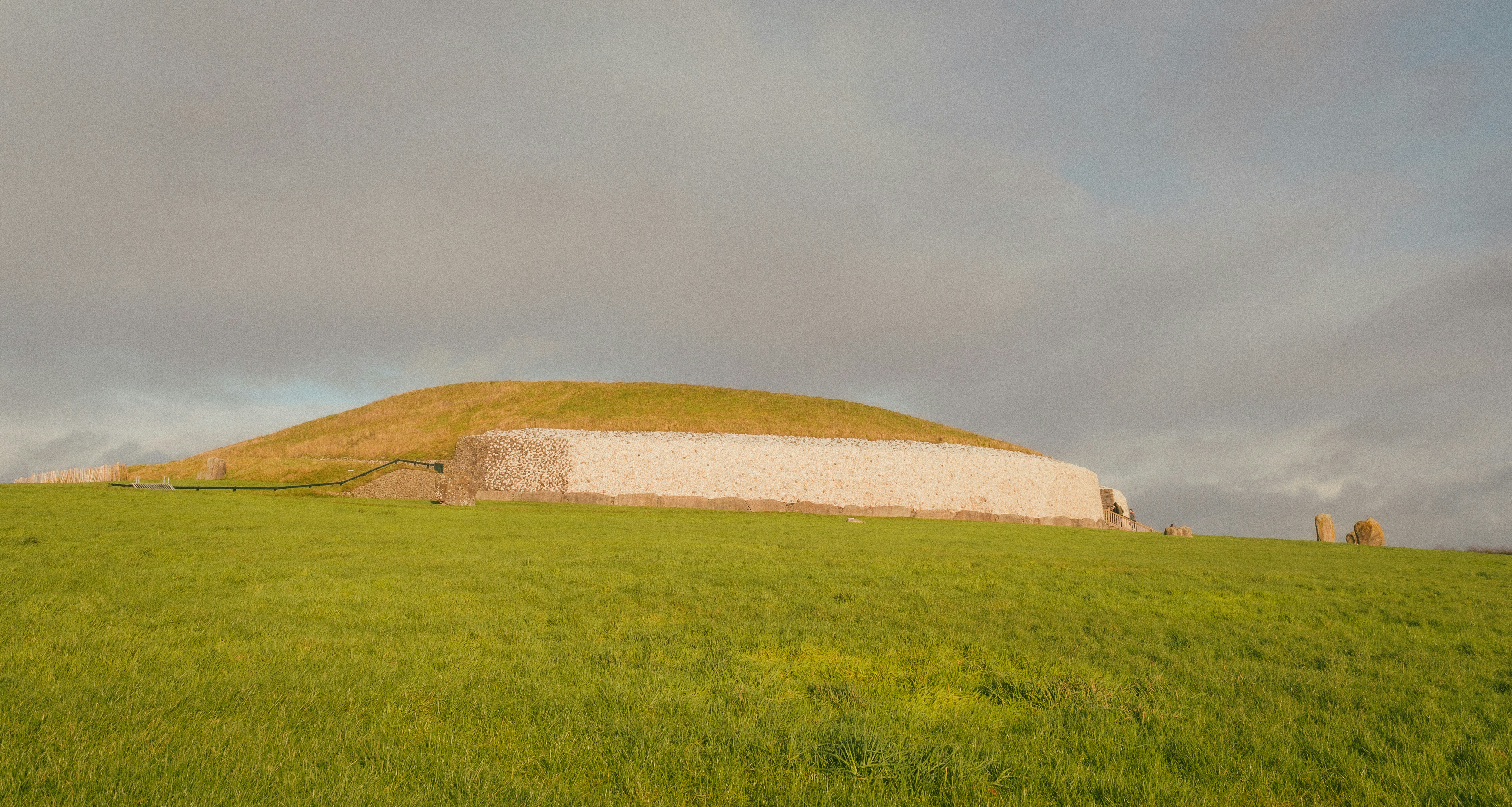 Ancient burial mound on a grassy hill under cloudy sky photo – Free ...