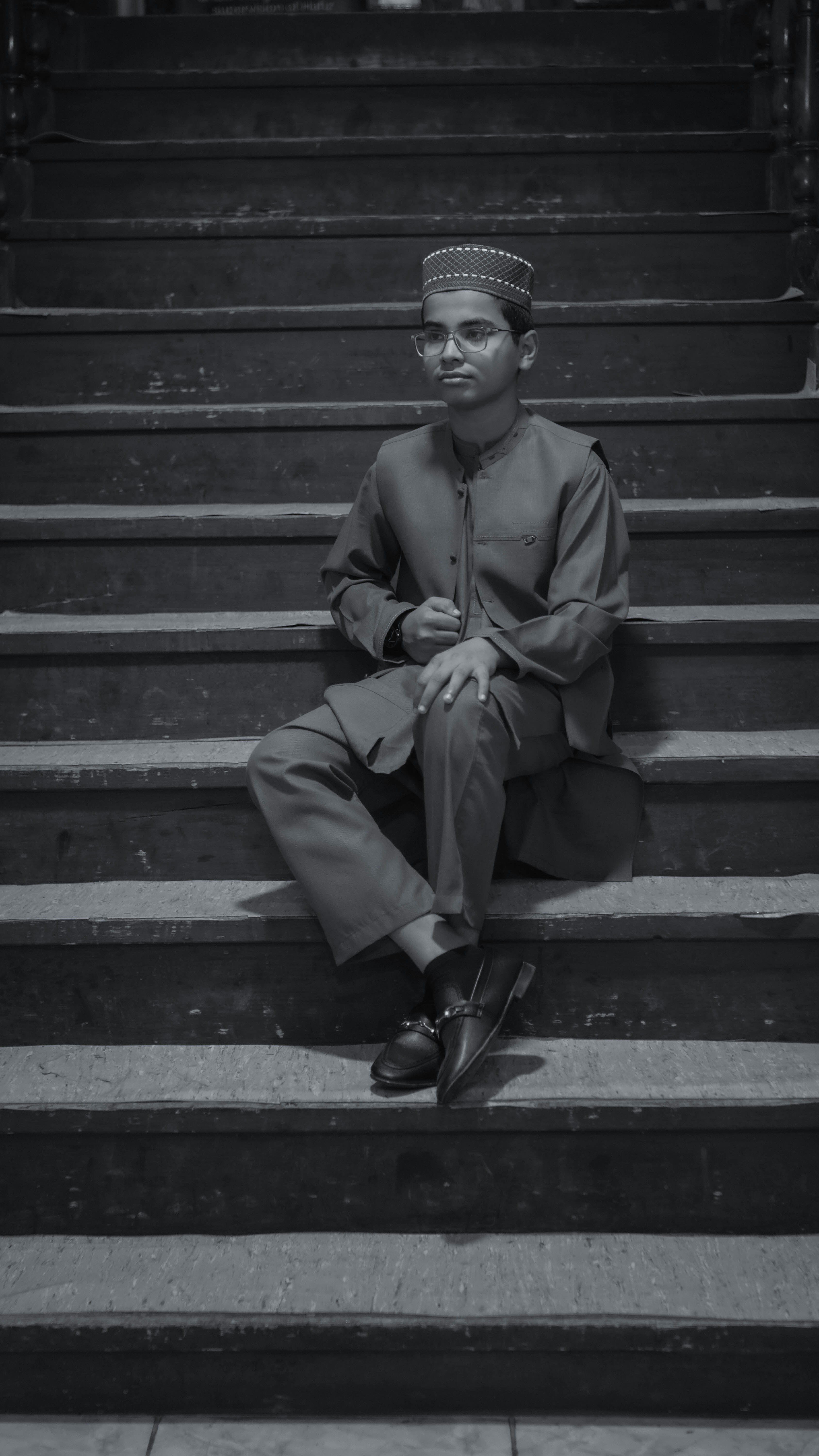 Quiet Authority: A Youthful Attache on Stone Steps