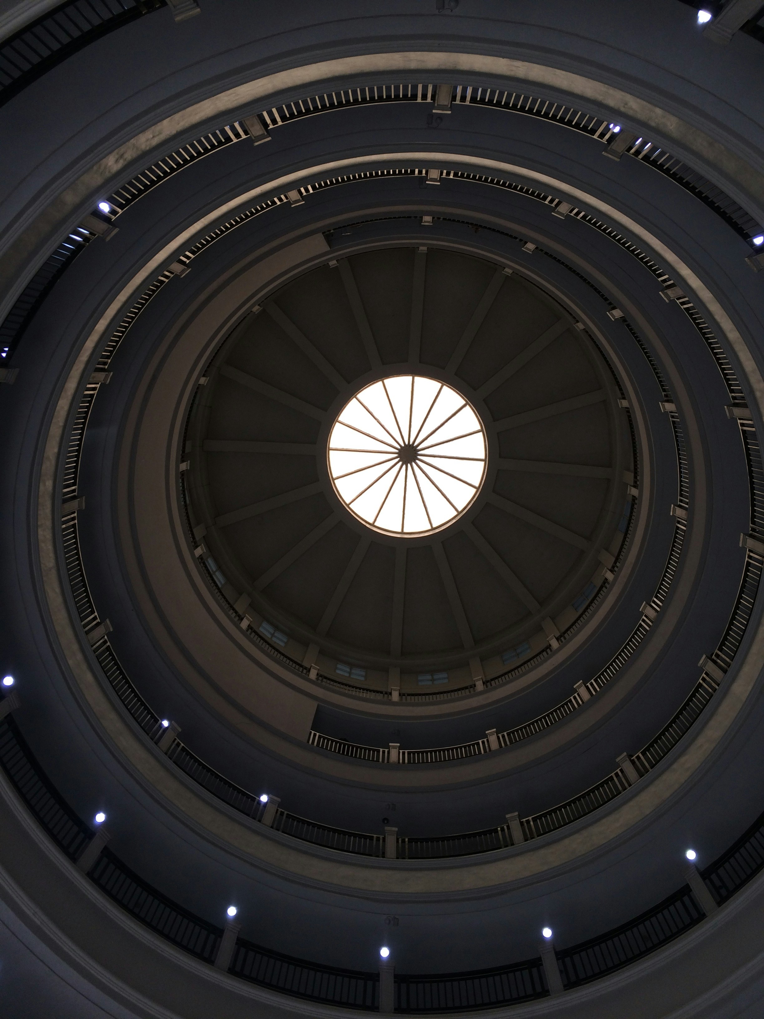 Circular Atrium: A Spiral Ceiling Draws the Eye to the Central Lantern