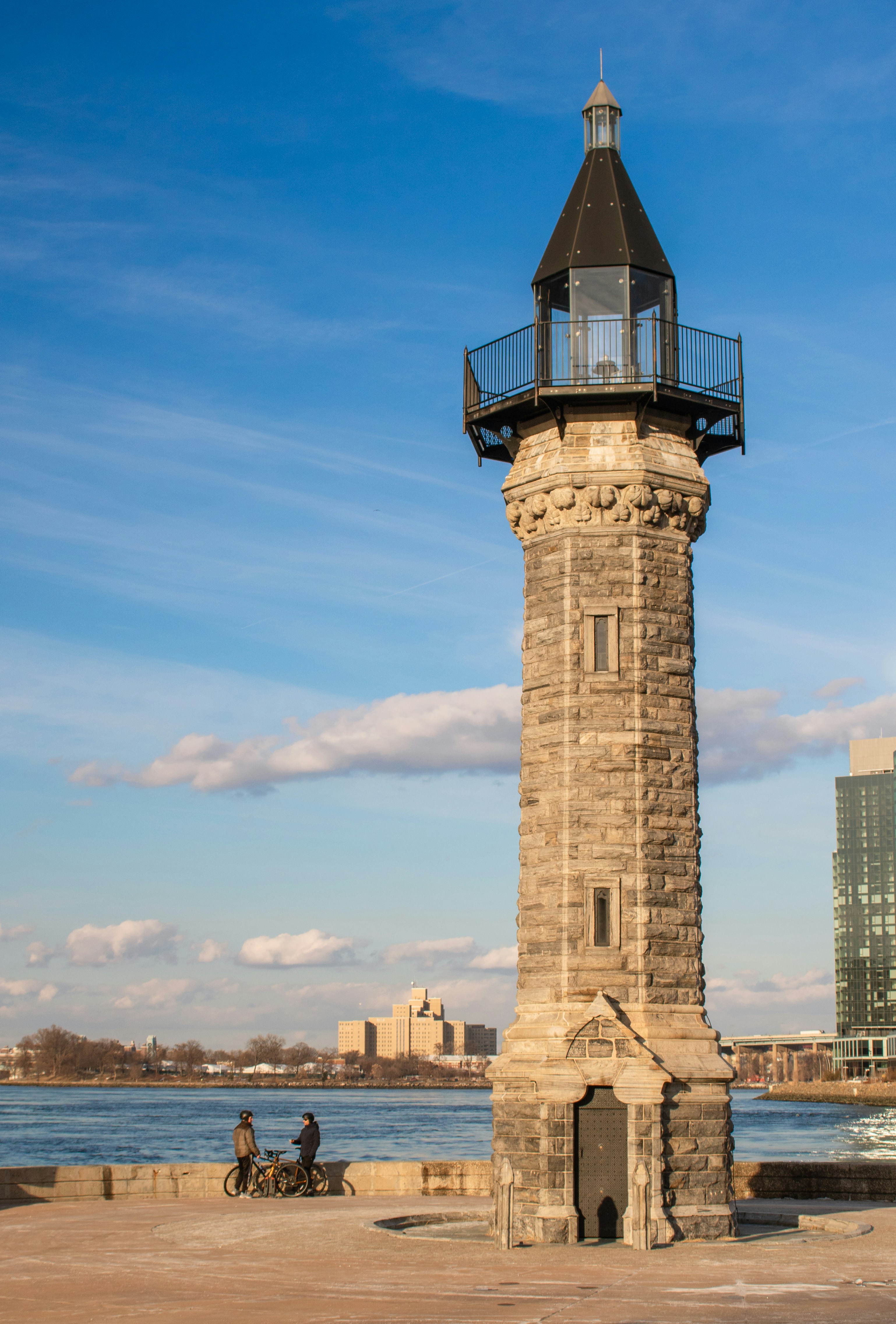 Beacon by the Waterfront: A Coastal Lighthouse Reaches for the Sky