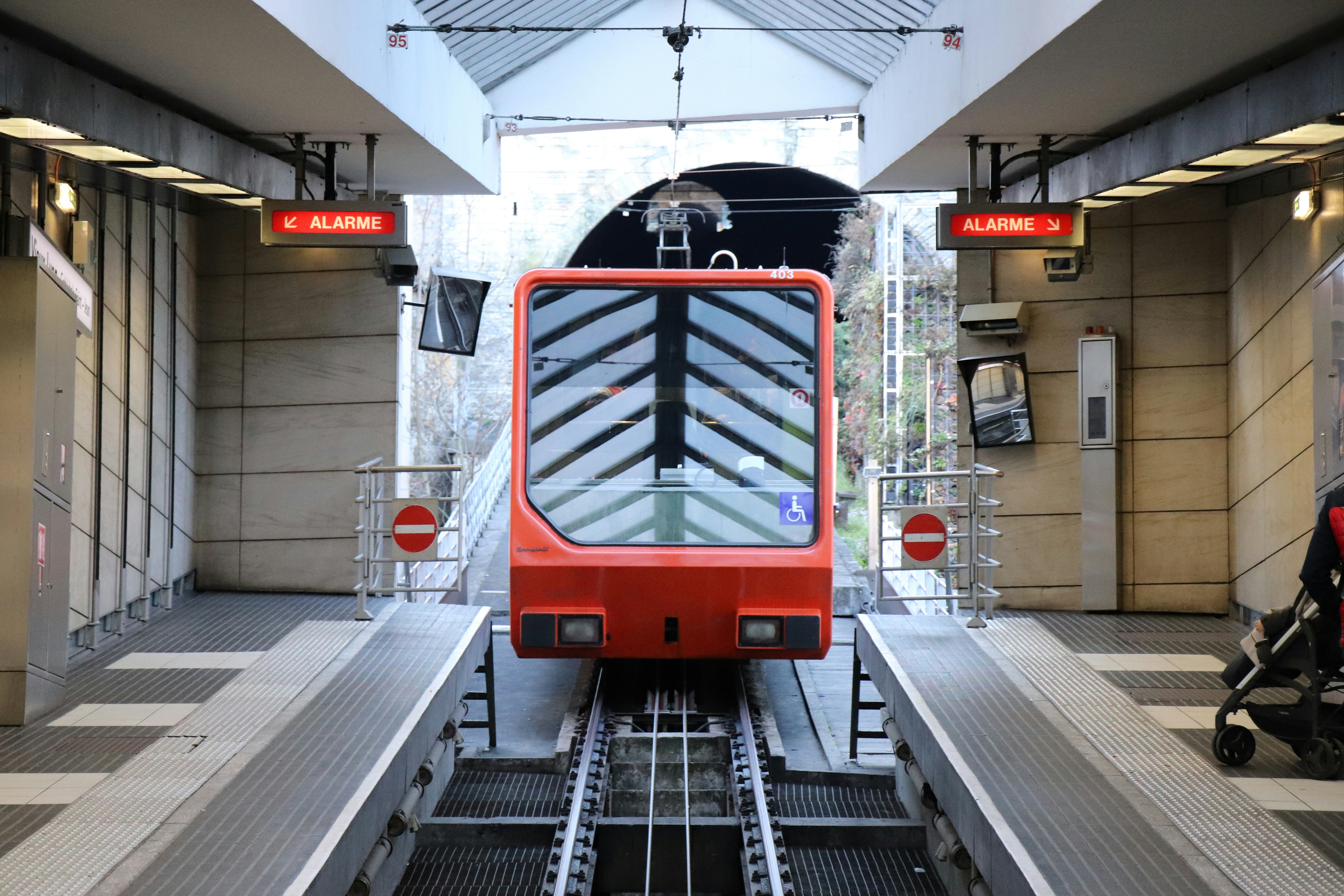 Symmetry at the Metro Gate: Red Train Framed by Platforms