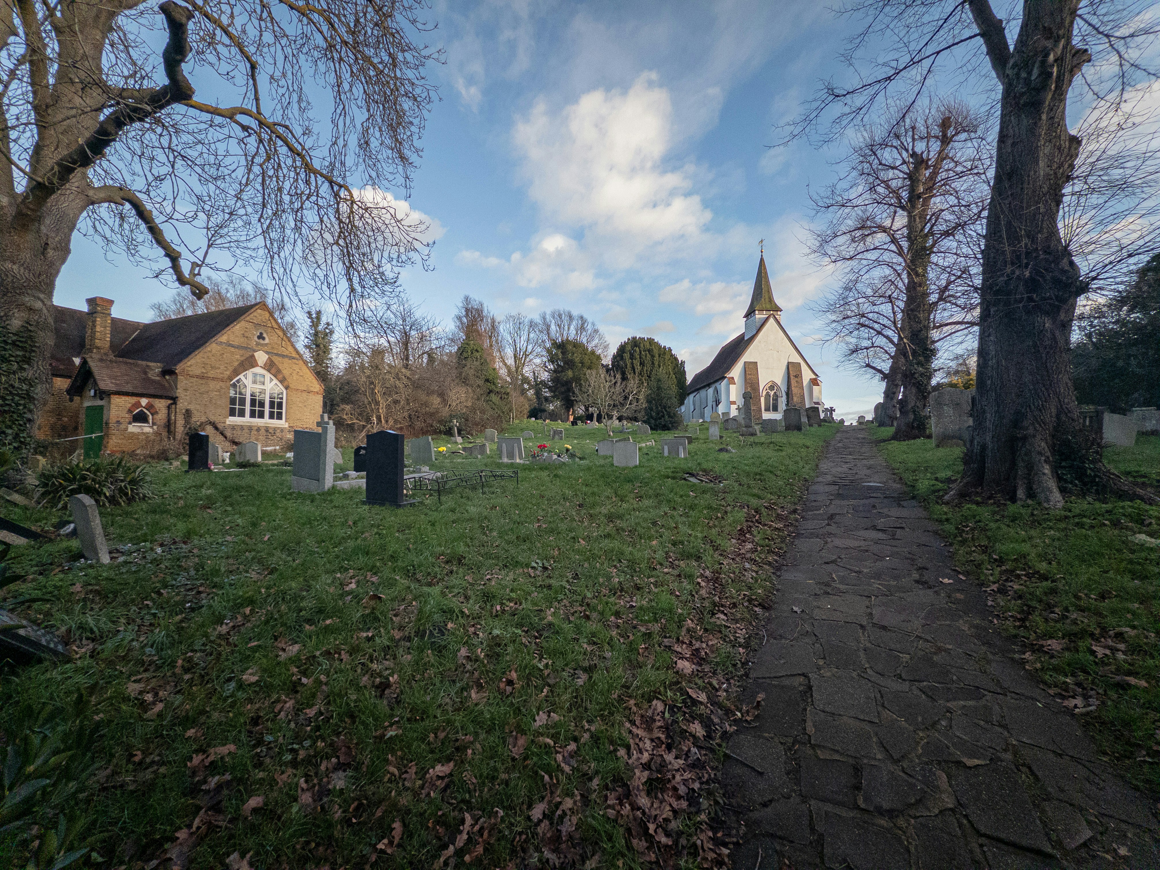 Path Through a Quiet Cemetery Toward a Small Church