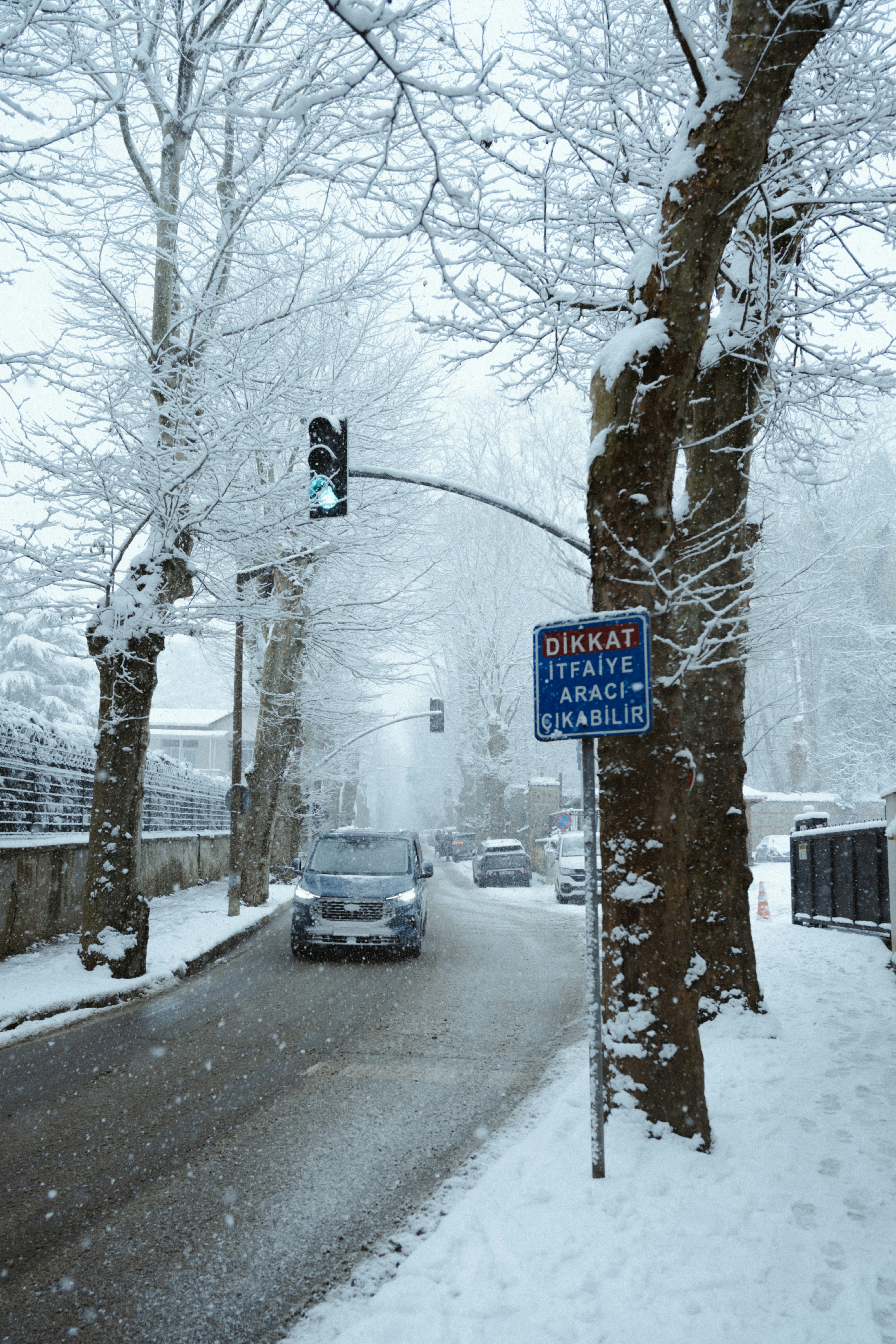 Winter Street Pulse: Snow-Clad Checkpoint Under a Quiet Arc