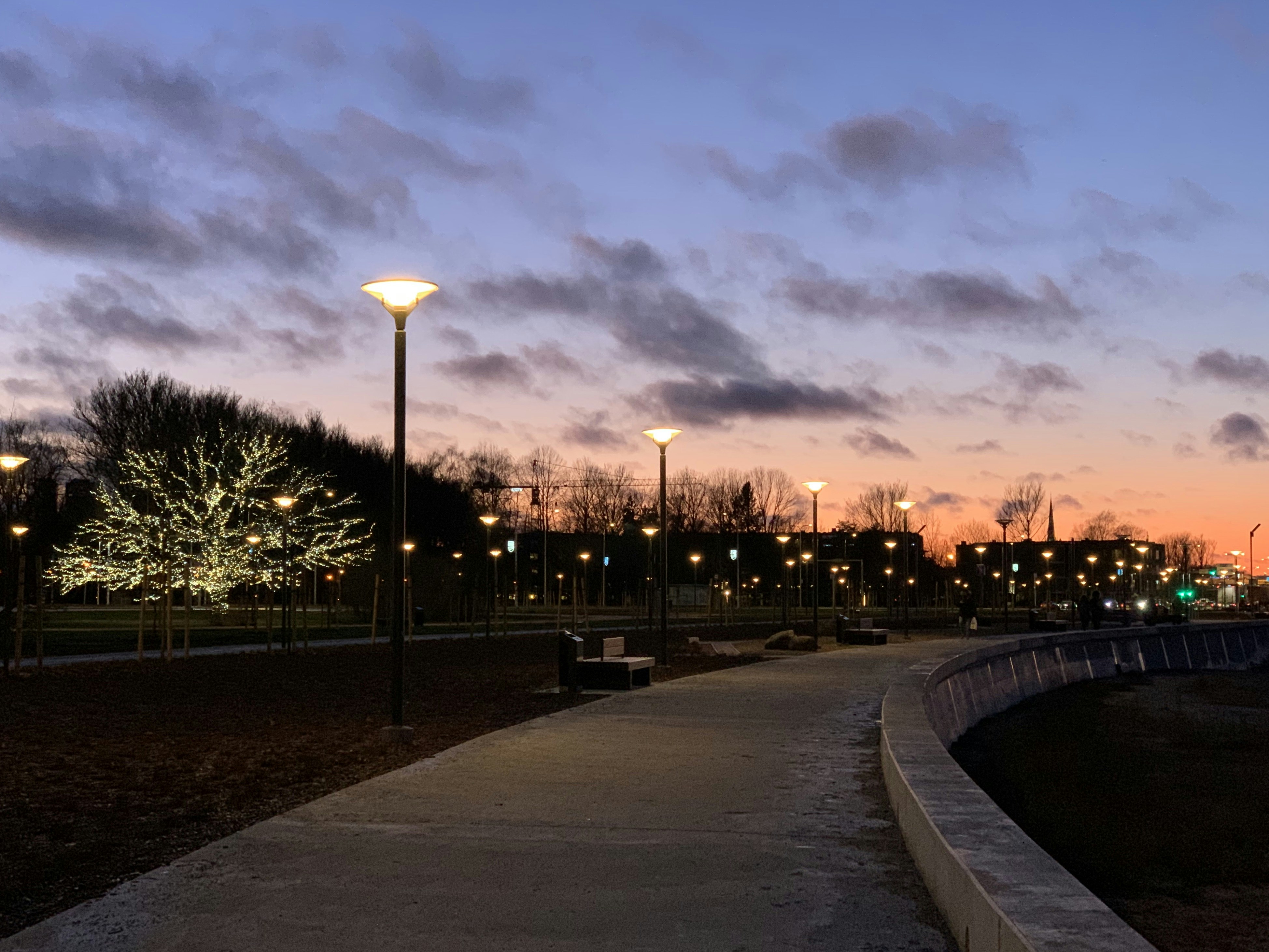Dusk along the illuminated riverwalk