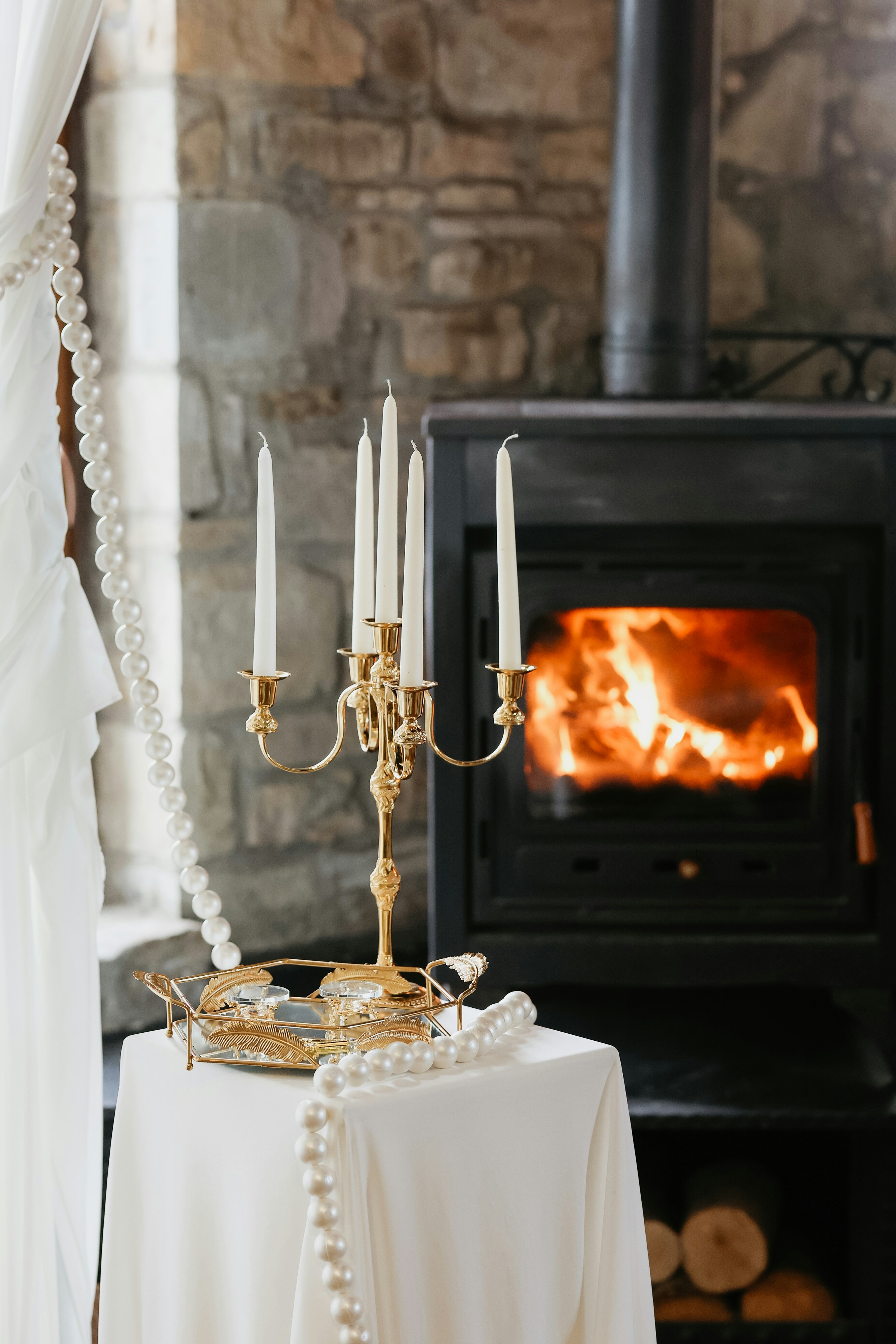 Candlelit ceremony centerpiece by the hearth