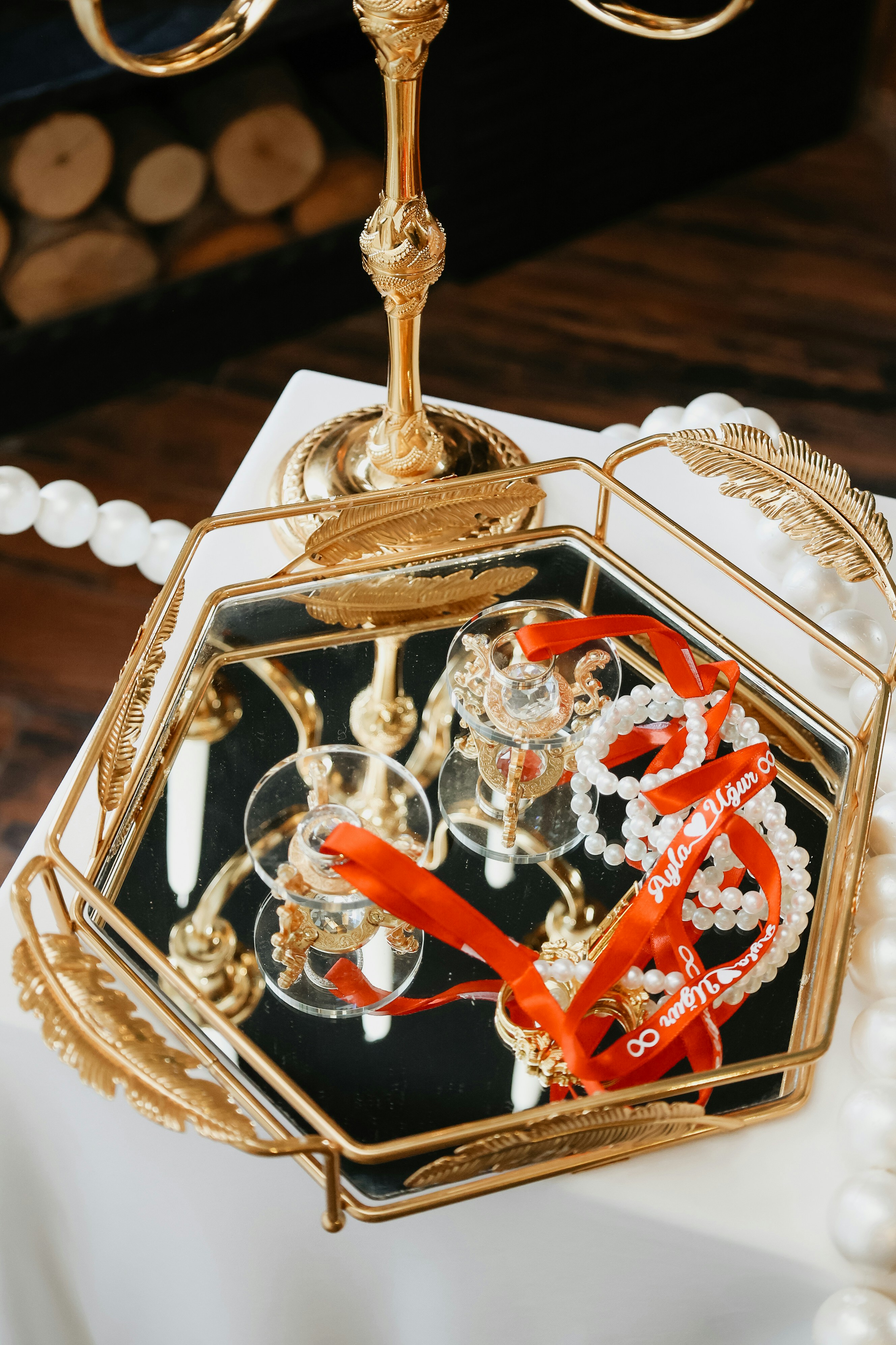 Gold-trimmed Geometric Mirror: Jewelry and Candlestick Reverie