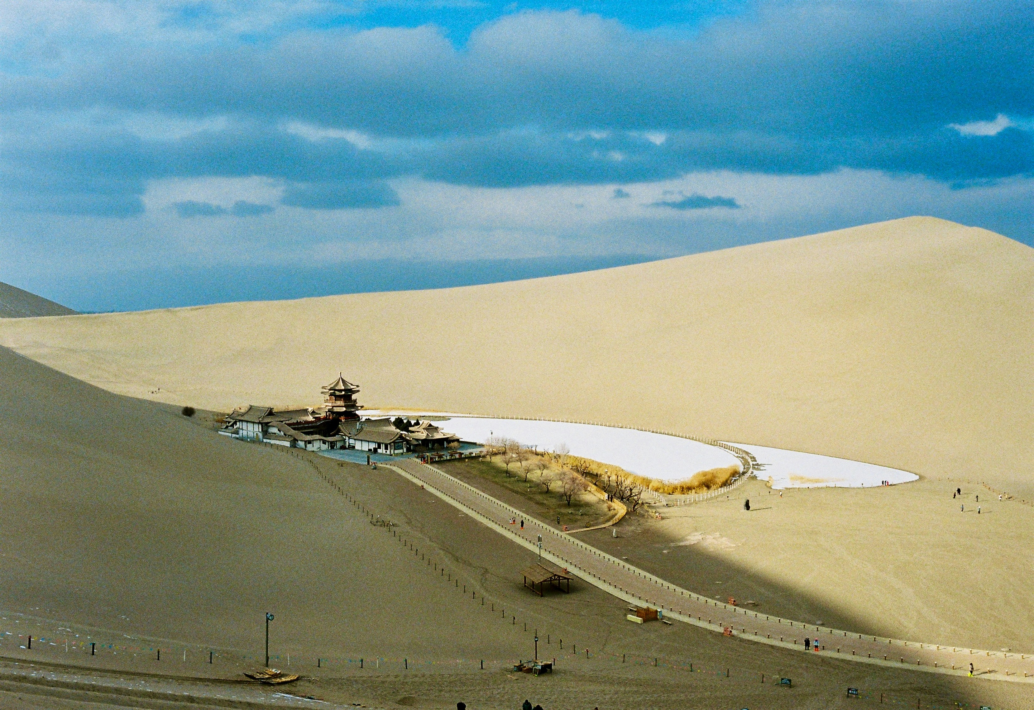 Desert Dunes and Watered Roadway