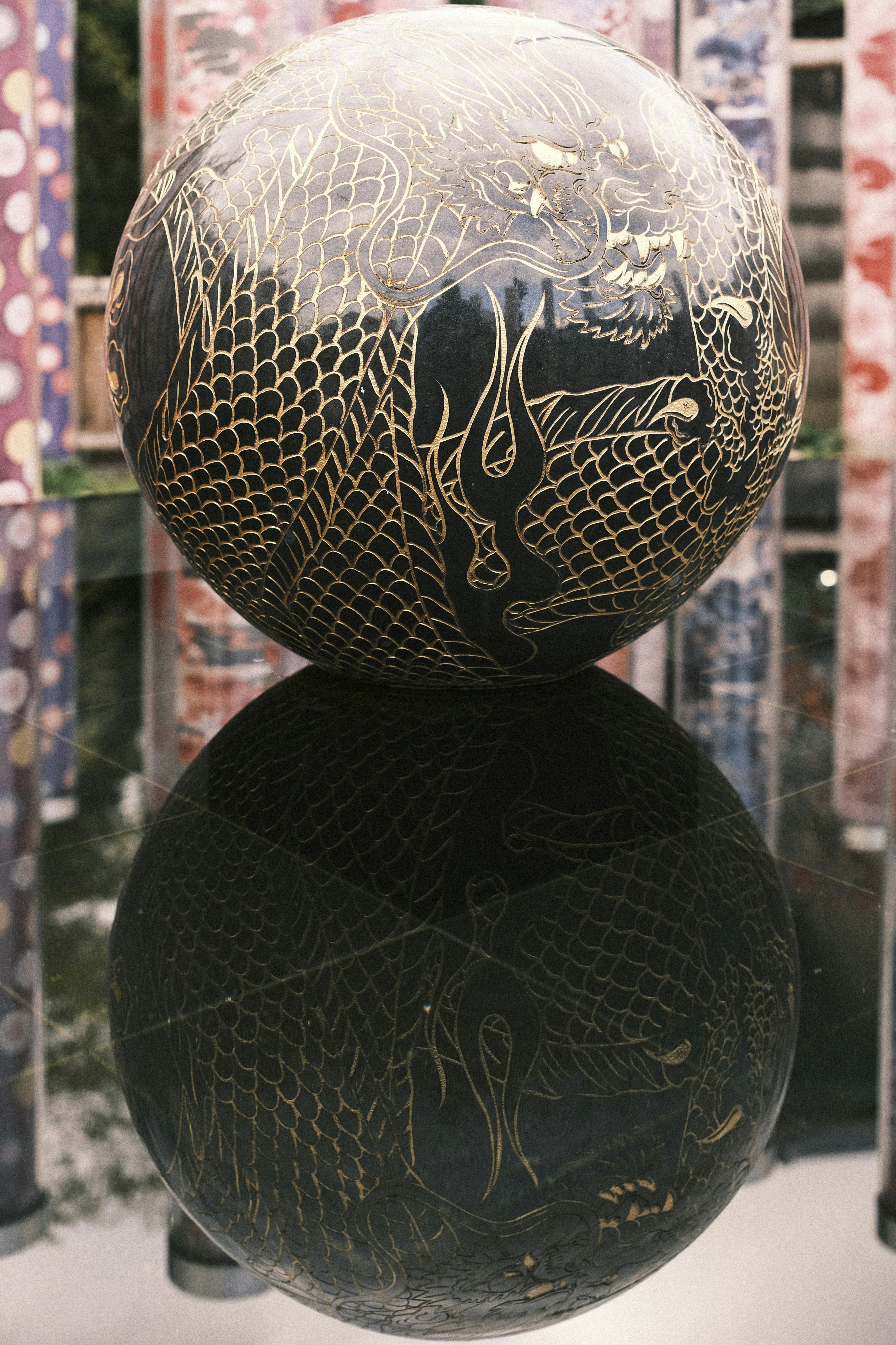 Dragon-etched Sphere on a Momentary Mirror