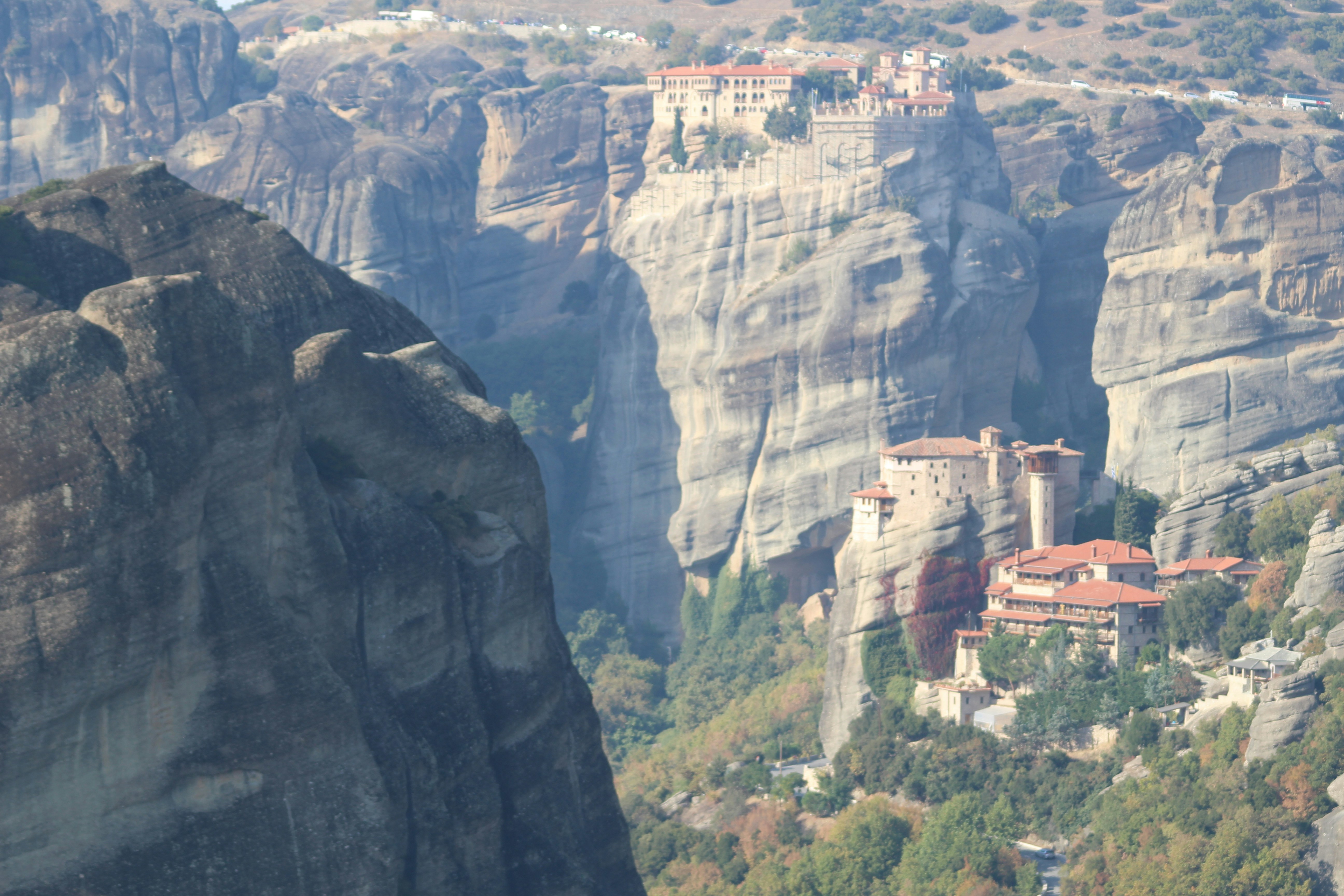 Cliffside monastic village perched on towering rock spires