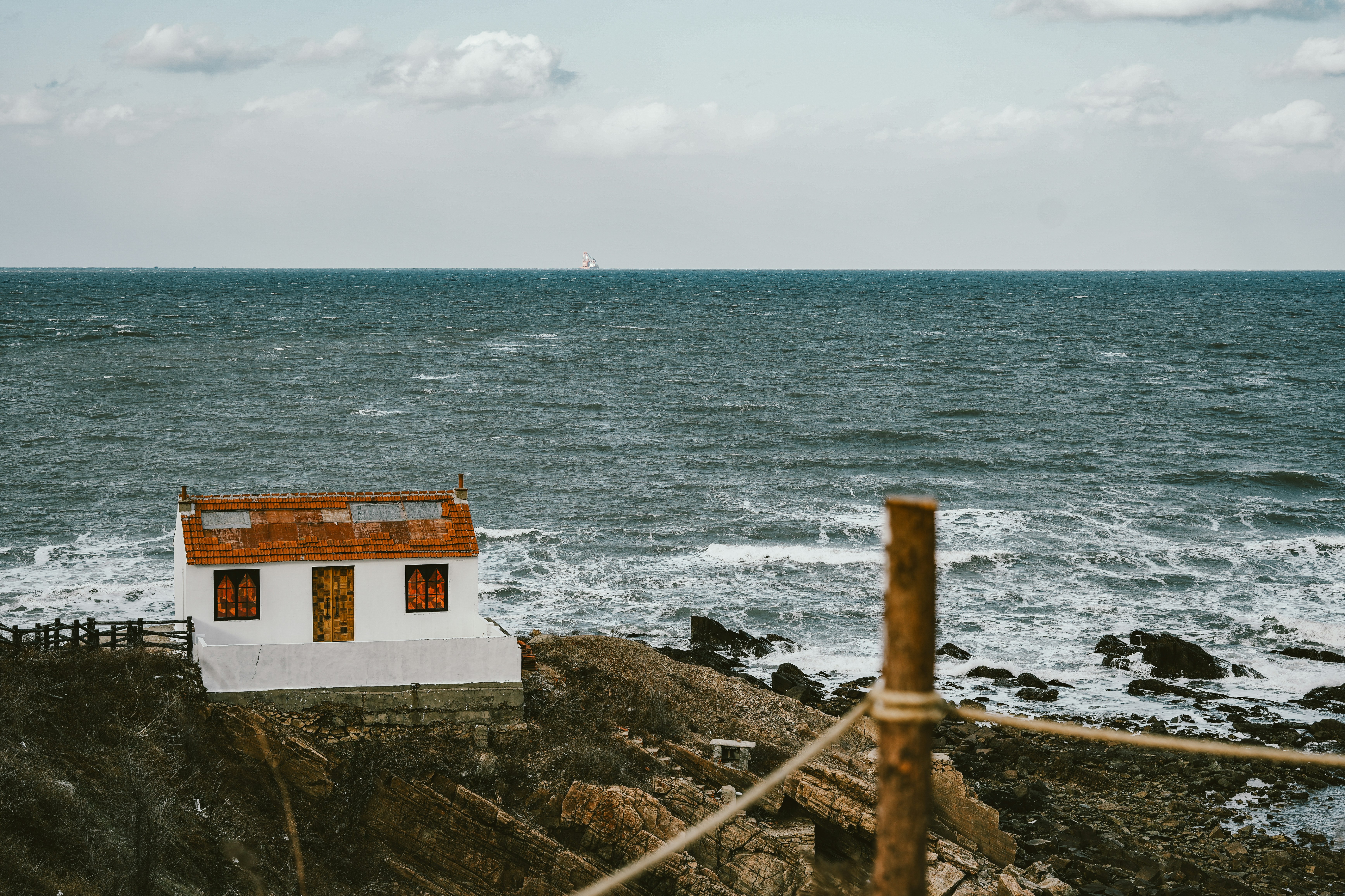 Coastal Cabin Beneath a Brisk Atlantic Sky