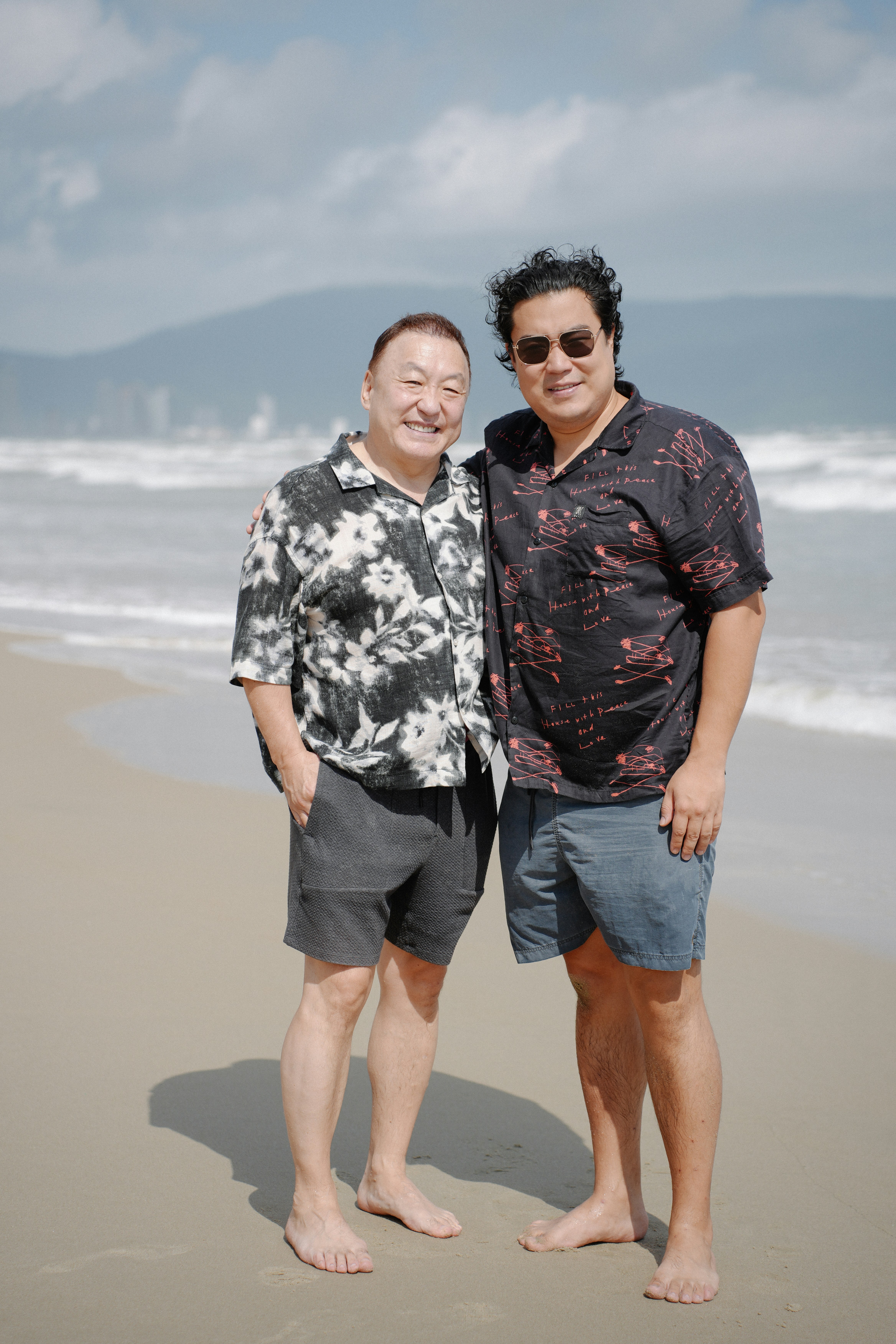 Two men standing on a beach