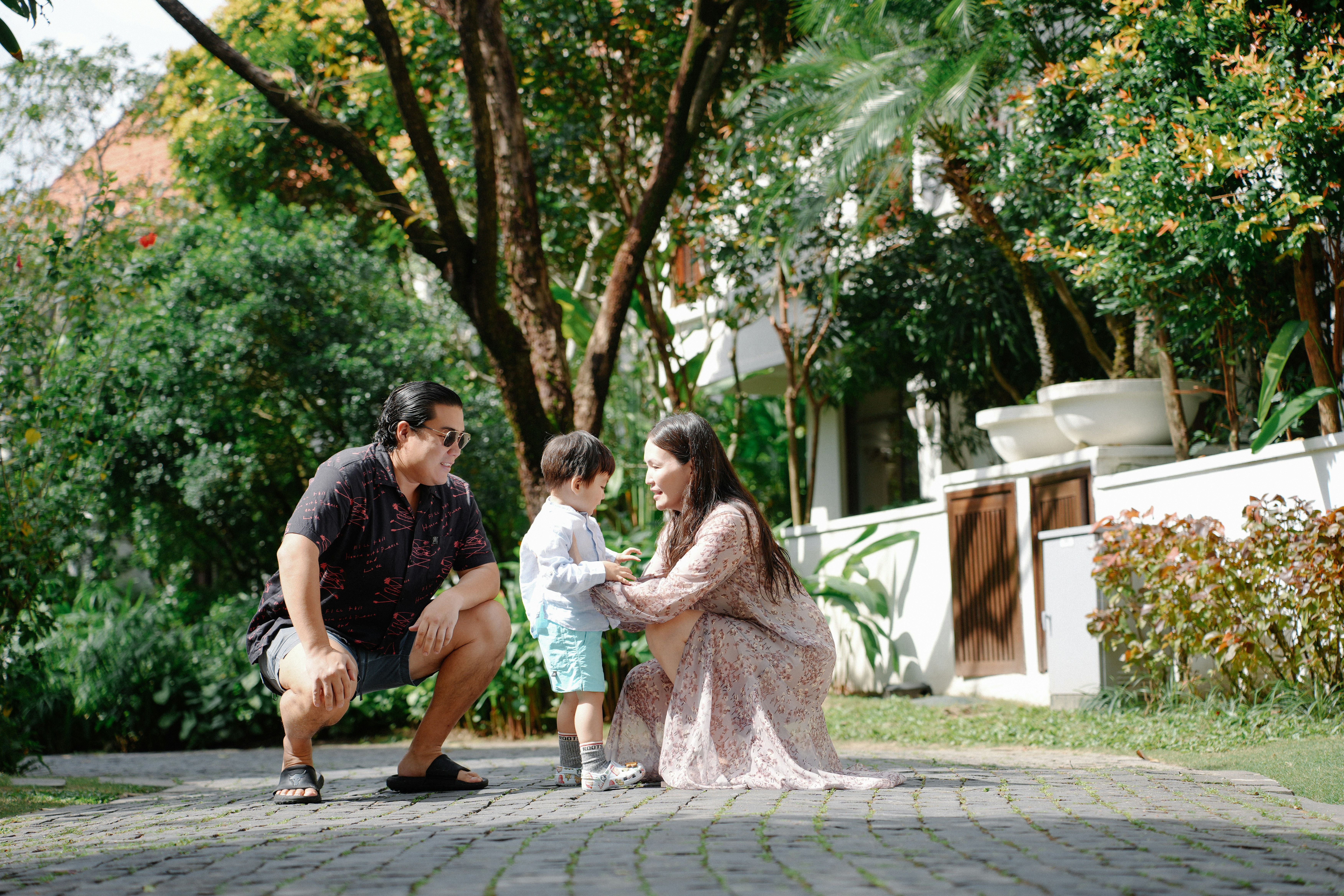 Family interacting with their son outdoors