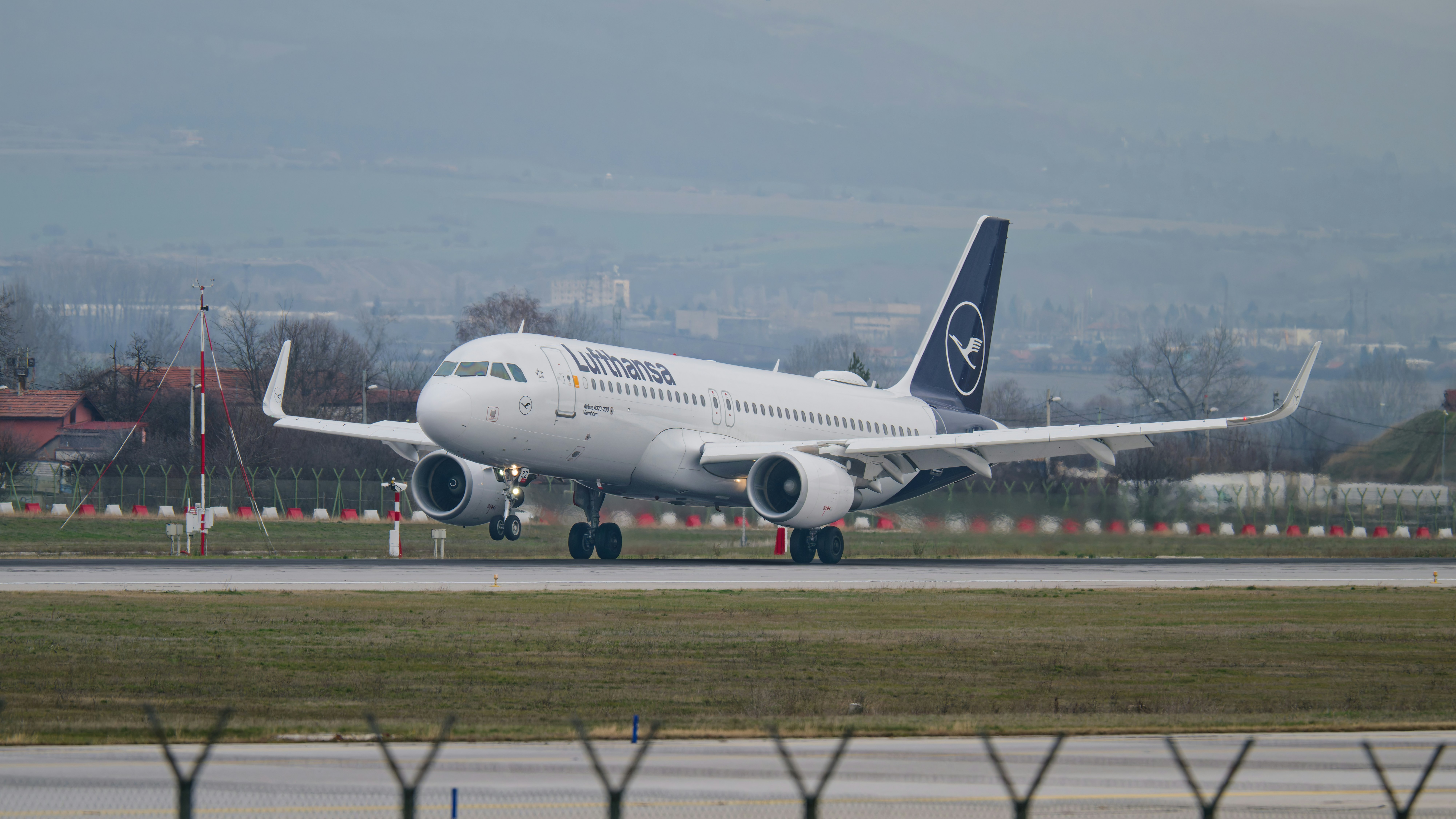 Lufthansa A320 on rollout: poised at the edge of the runway