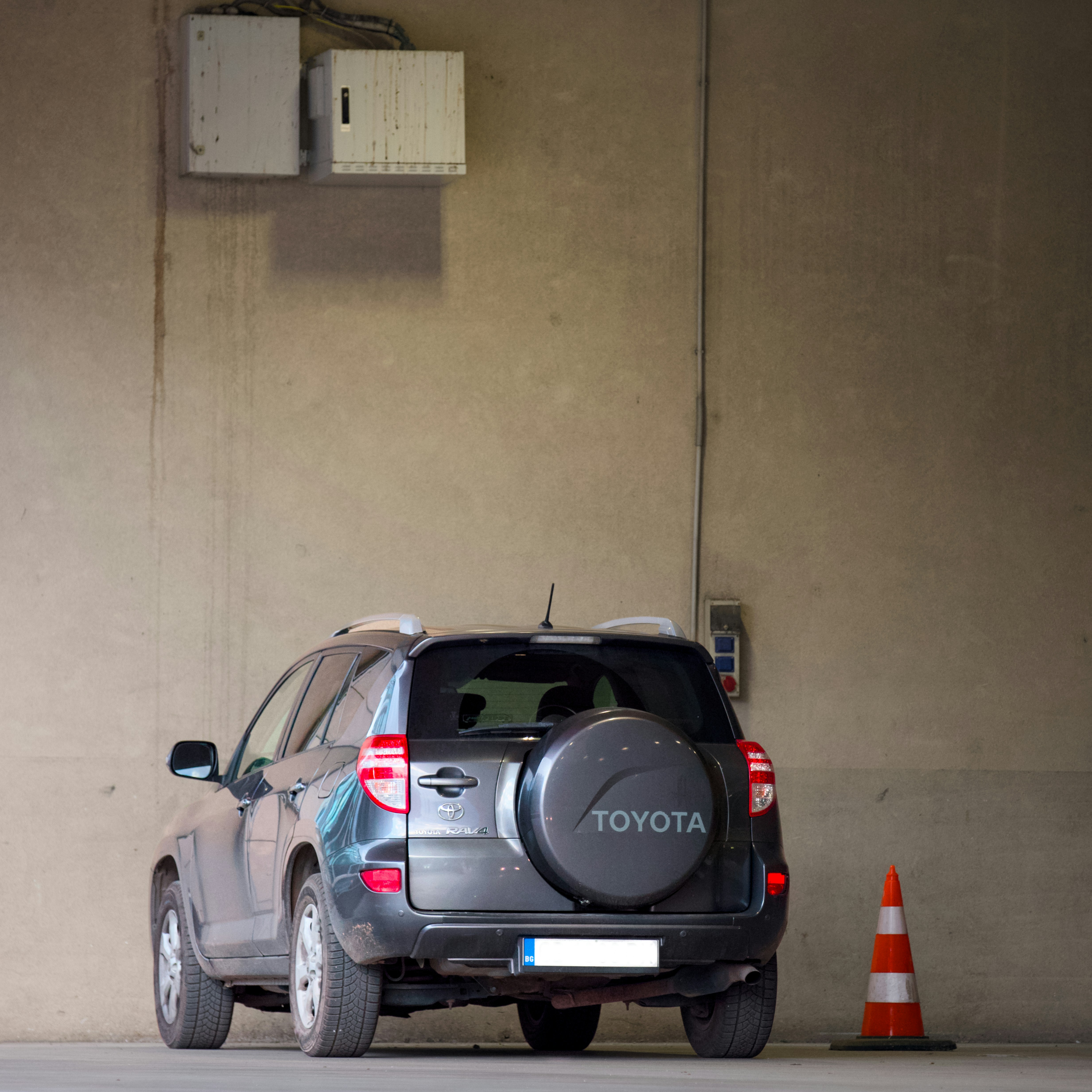 Parking Garage Quiet: Toyota SUV in a Concrete Spotlight