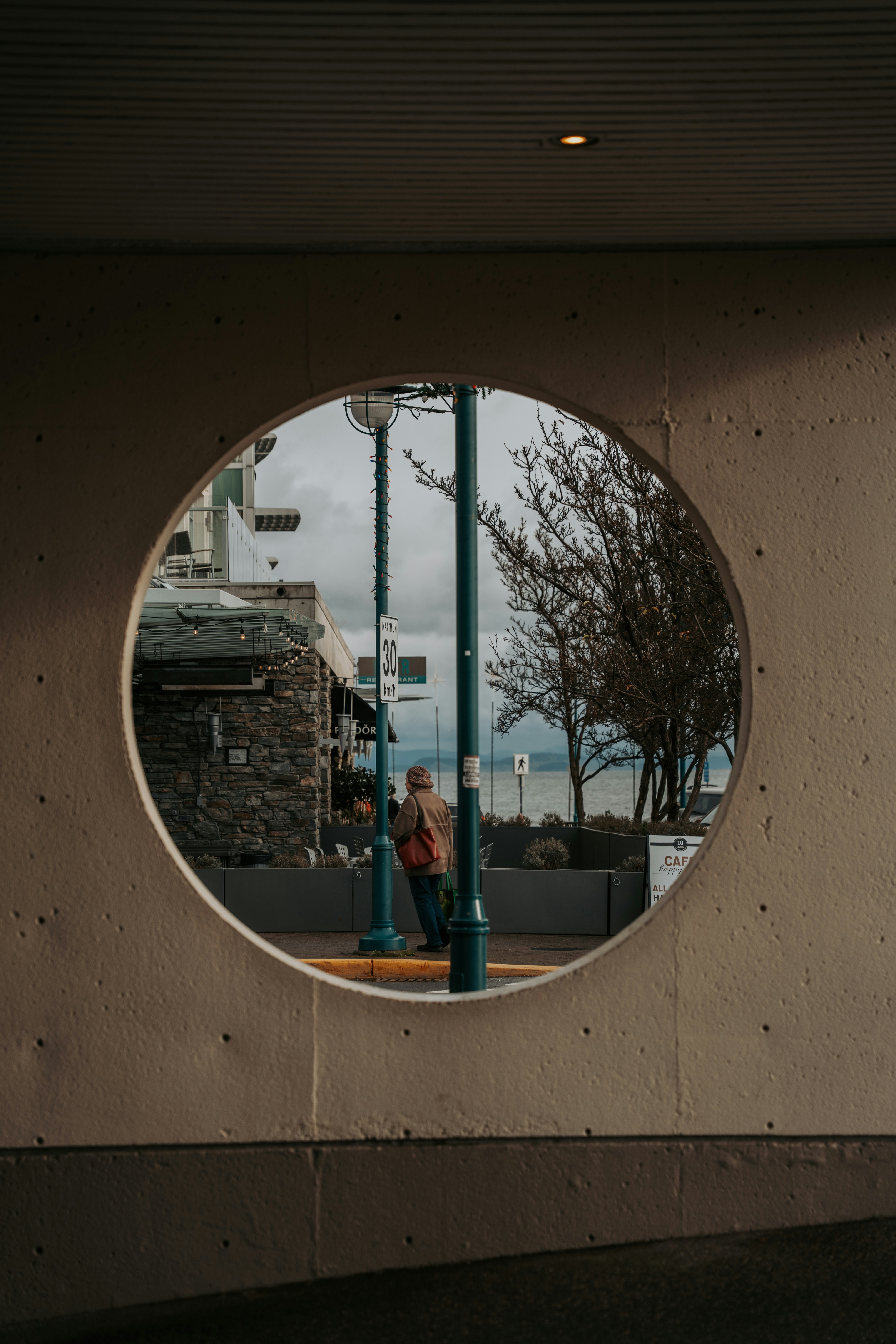 Through the Circular Window: A Stranger at the Pier