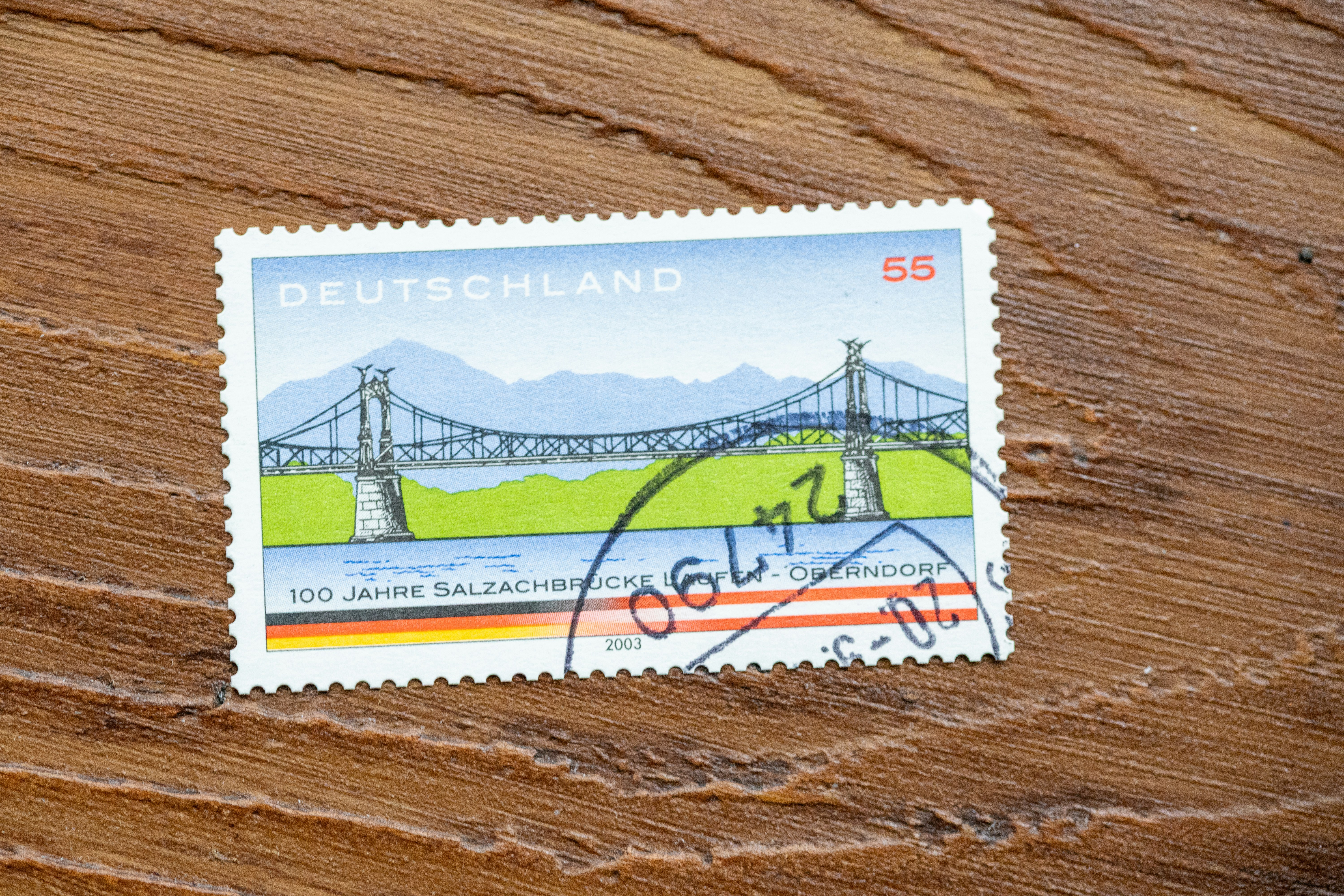 Blue Berlin Bridge Stamp: A Moment of German Heritage on Wood Grain