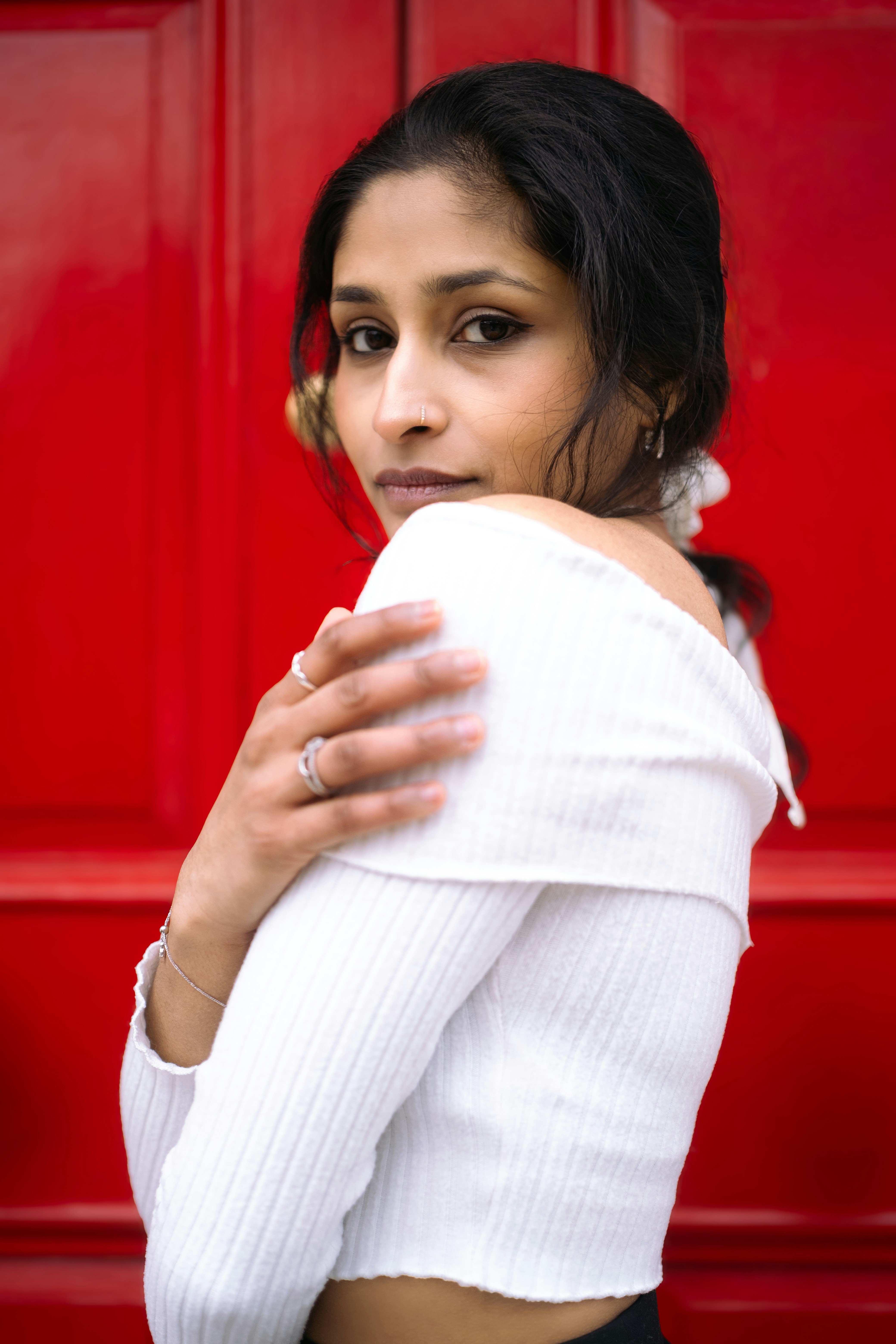 Red Door, White Knit: A Portrait of Quiet Confidence