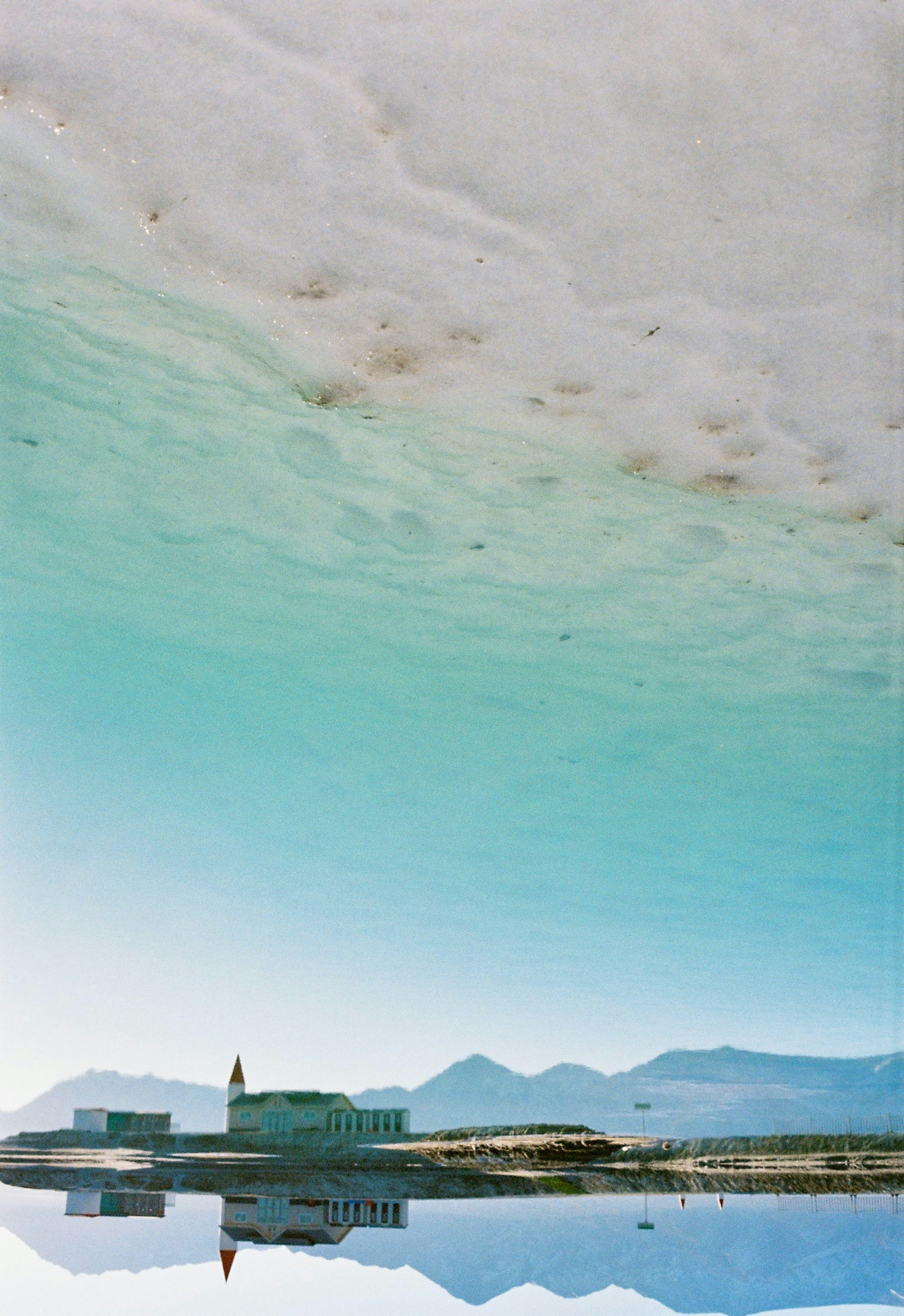 Mirage at the Coast: A Quiet Horizon with a Salt-Tilled Beach