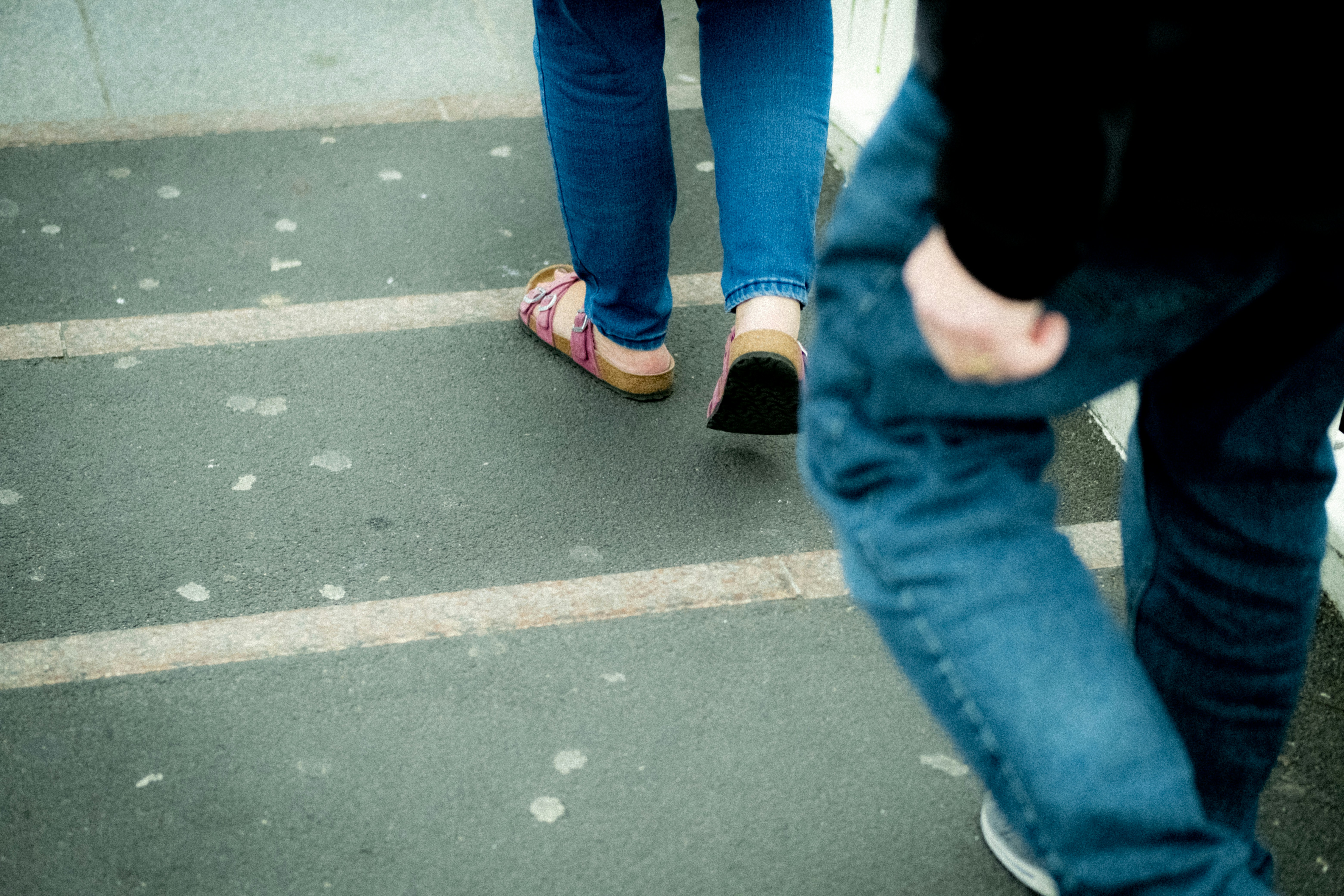Two Strides Ahead: Footsteps on a Quiet Asphalt Path