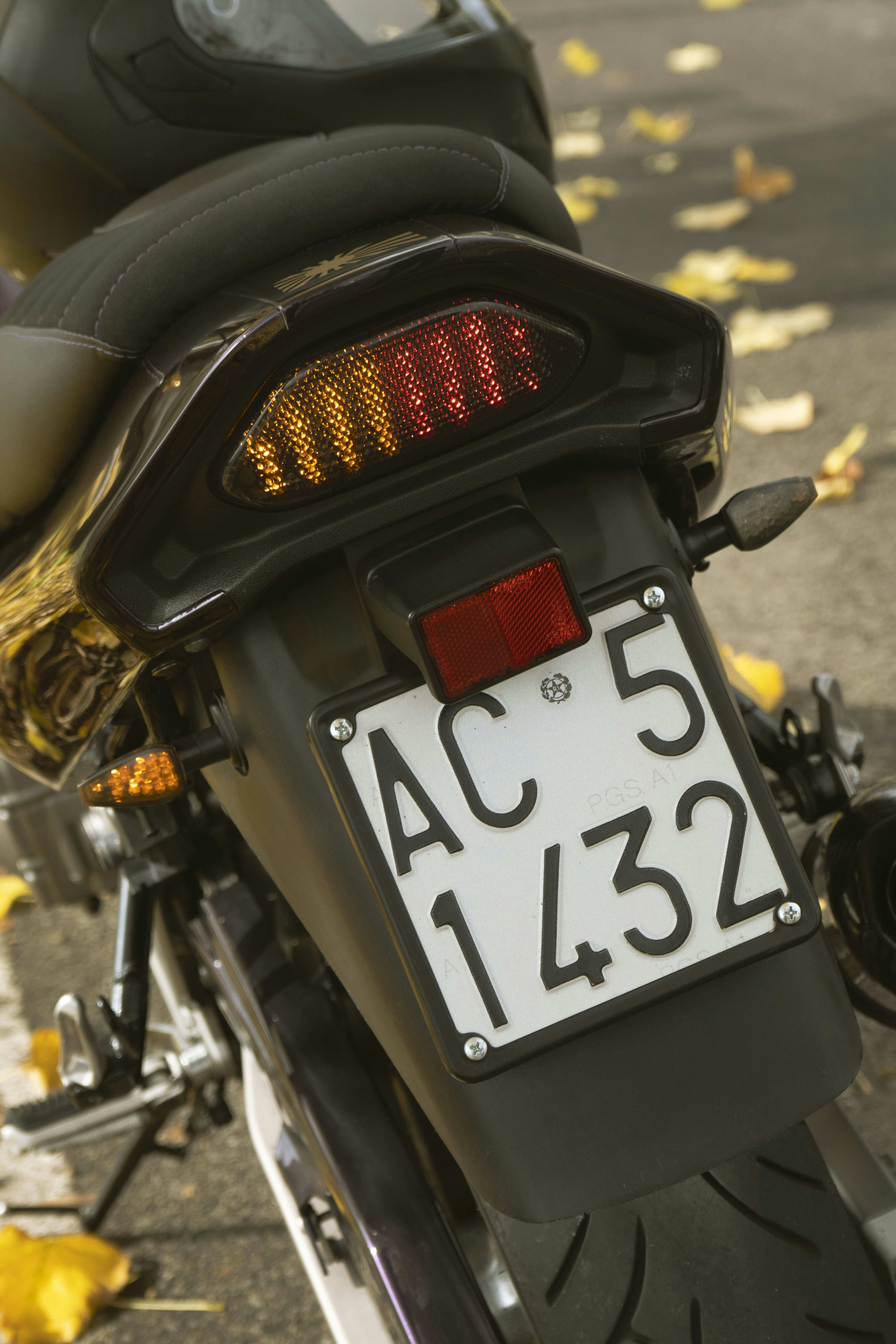 License Plate in Focus: A Motorcycle Backprofile at Dusk