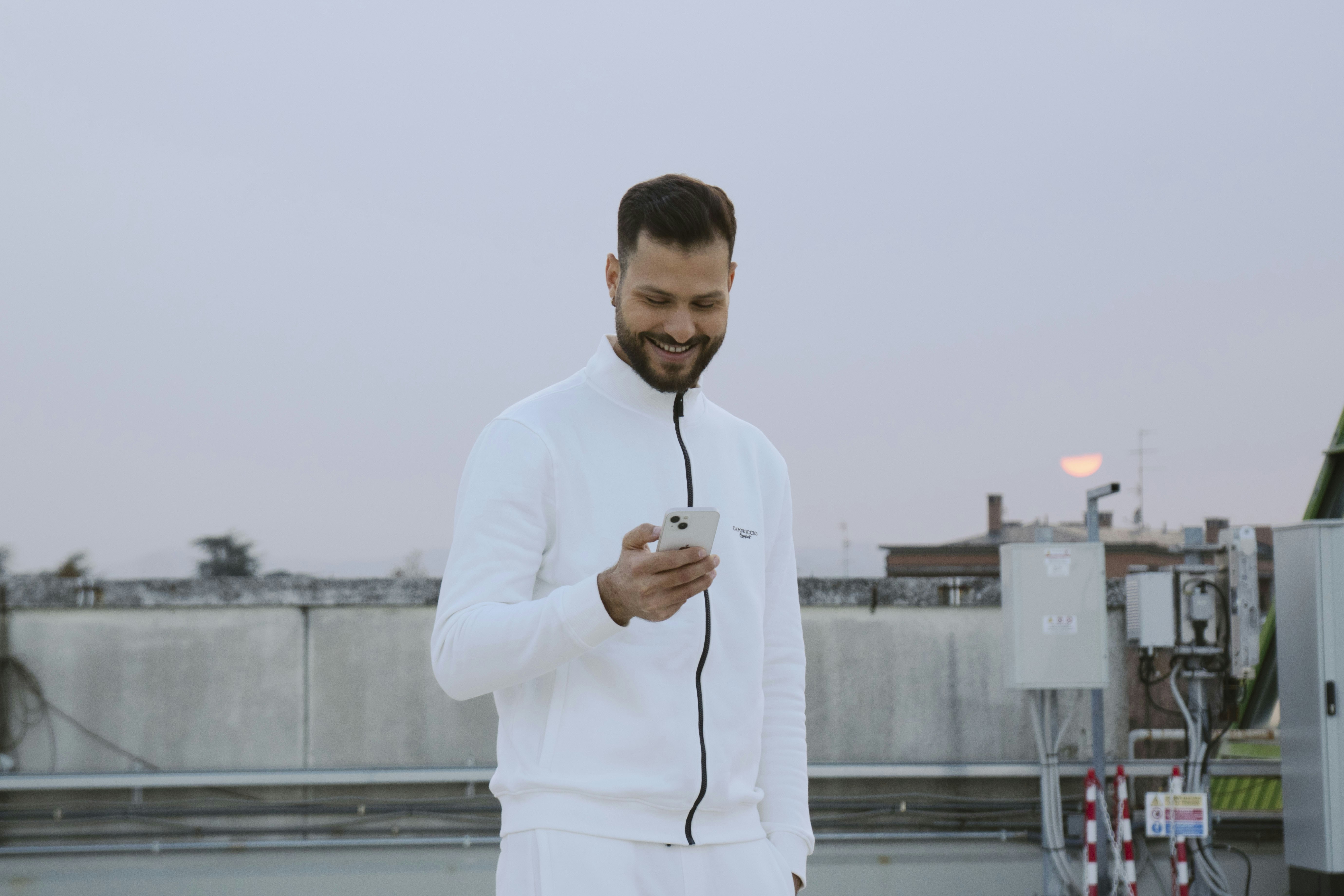 Quiet Confidence: A man in white on a rooftop screen-glance