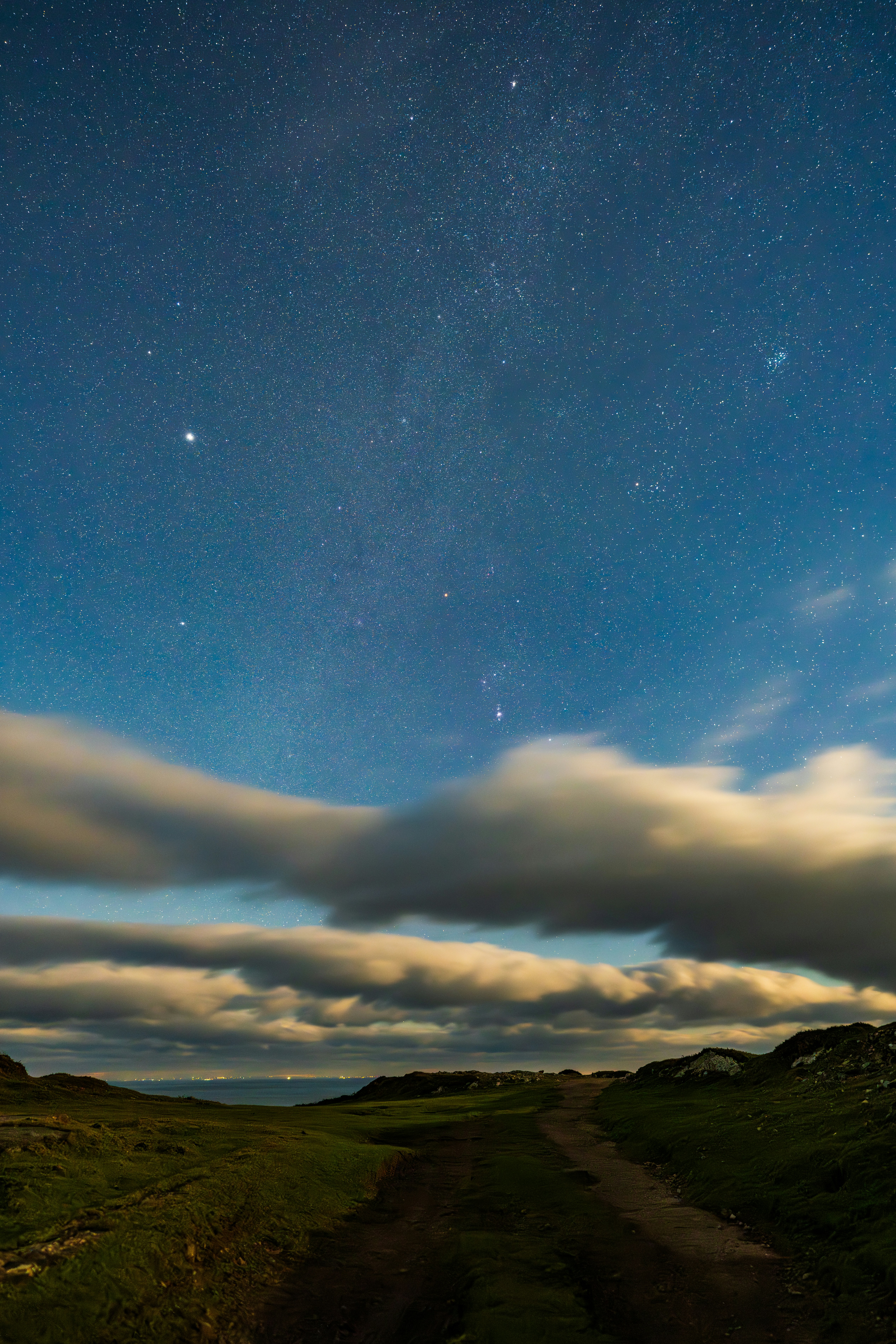Milky Way Veil Over a Quiet Coastal Ridge