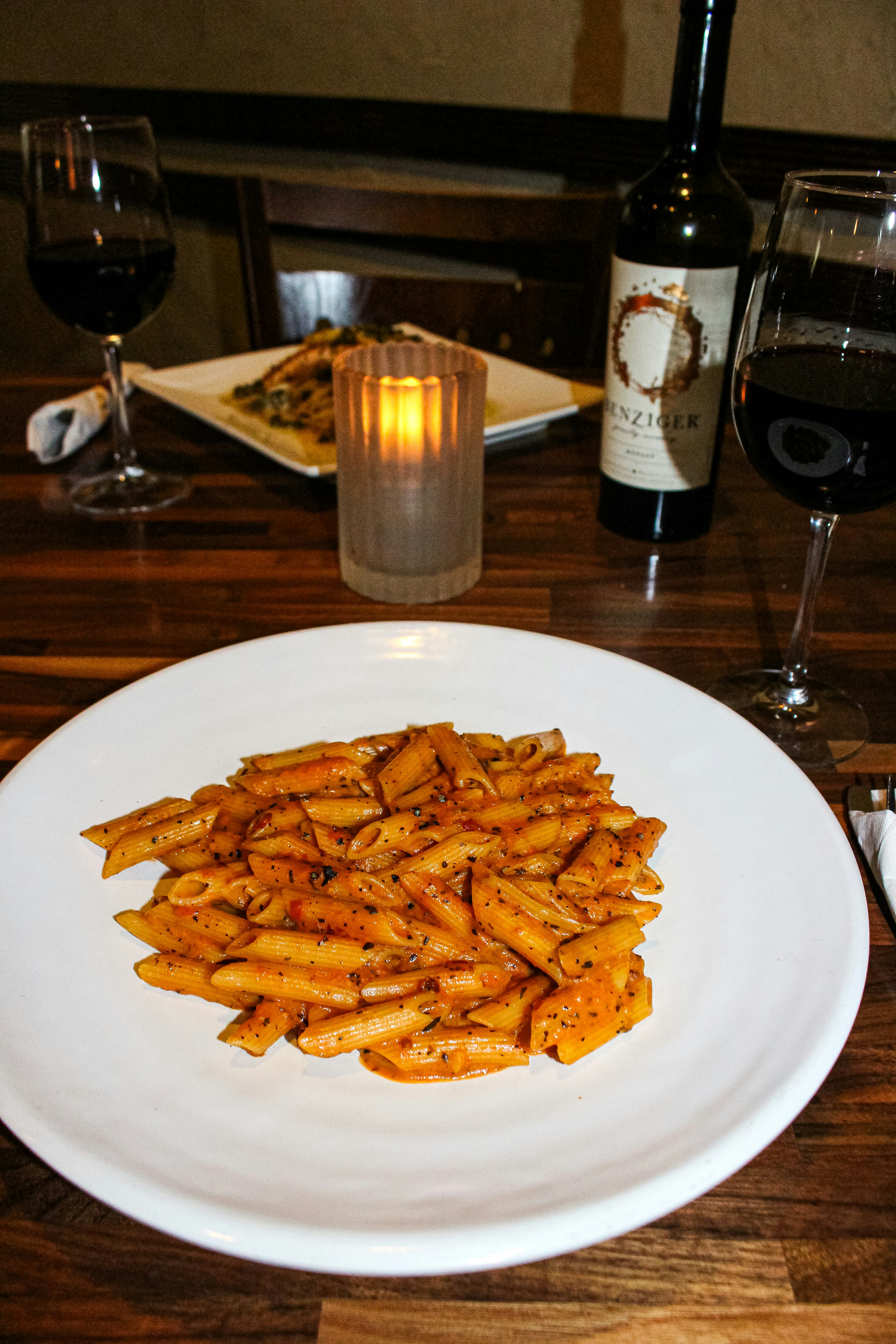 Pasta on a Table for Two: A Quiet Evening by Wine and Candlelight